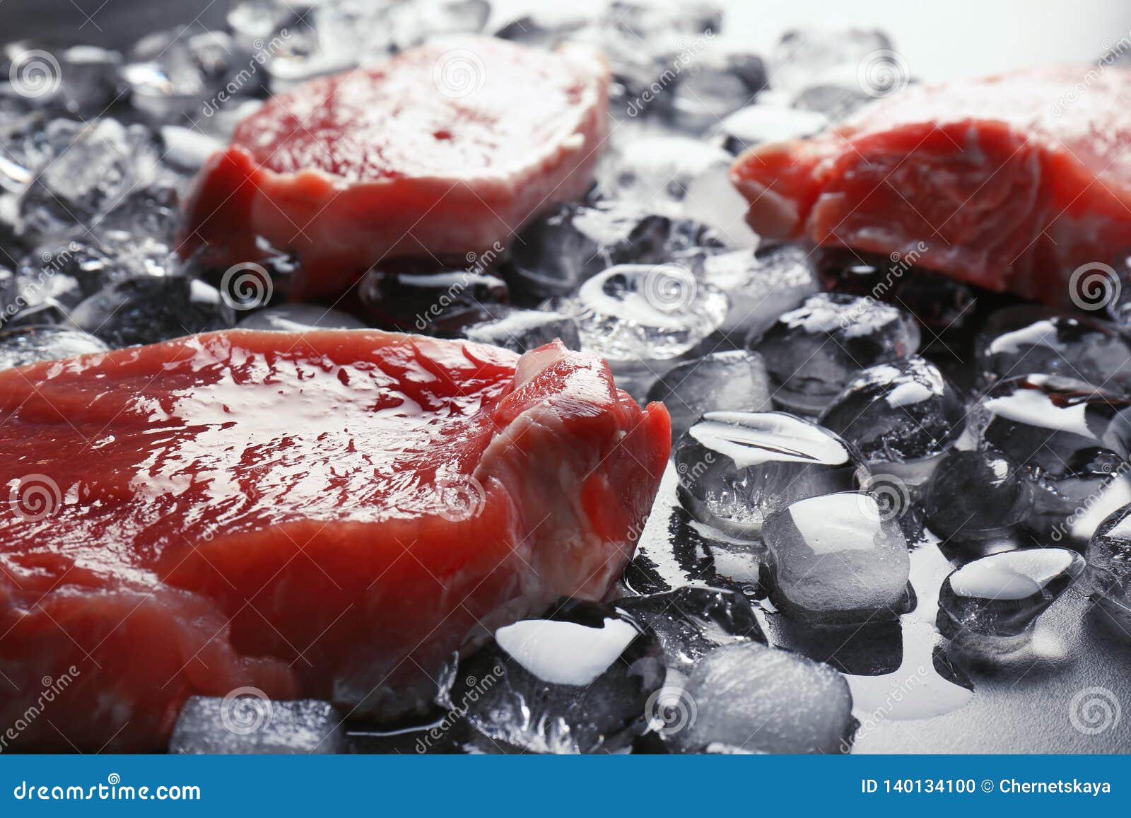 Raw meat and ice cubes stock photo. Image of natural - 140134100