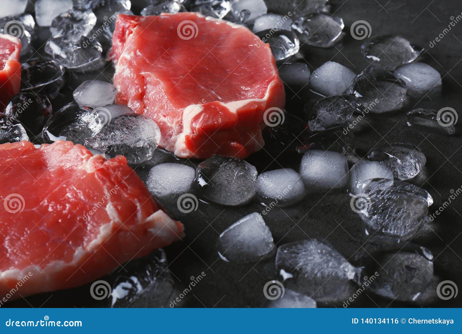 Raw meat and ice cubes stock photo. Image of freshness - 140134116
