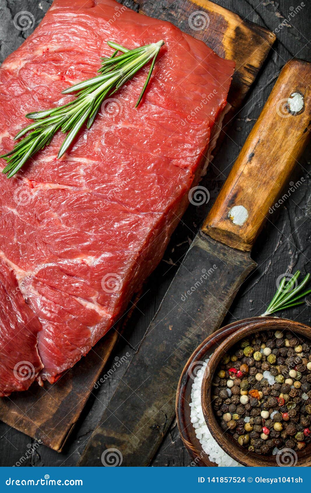Raw Meat. a Piece of Beef with Spices and Rosemary Stock Photo - Image ...