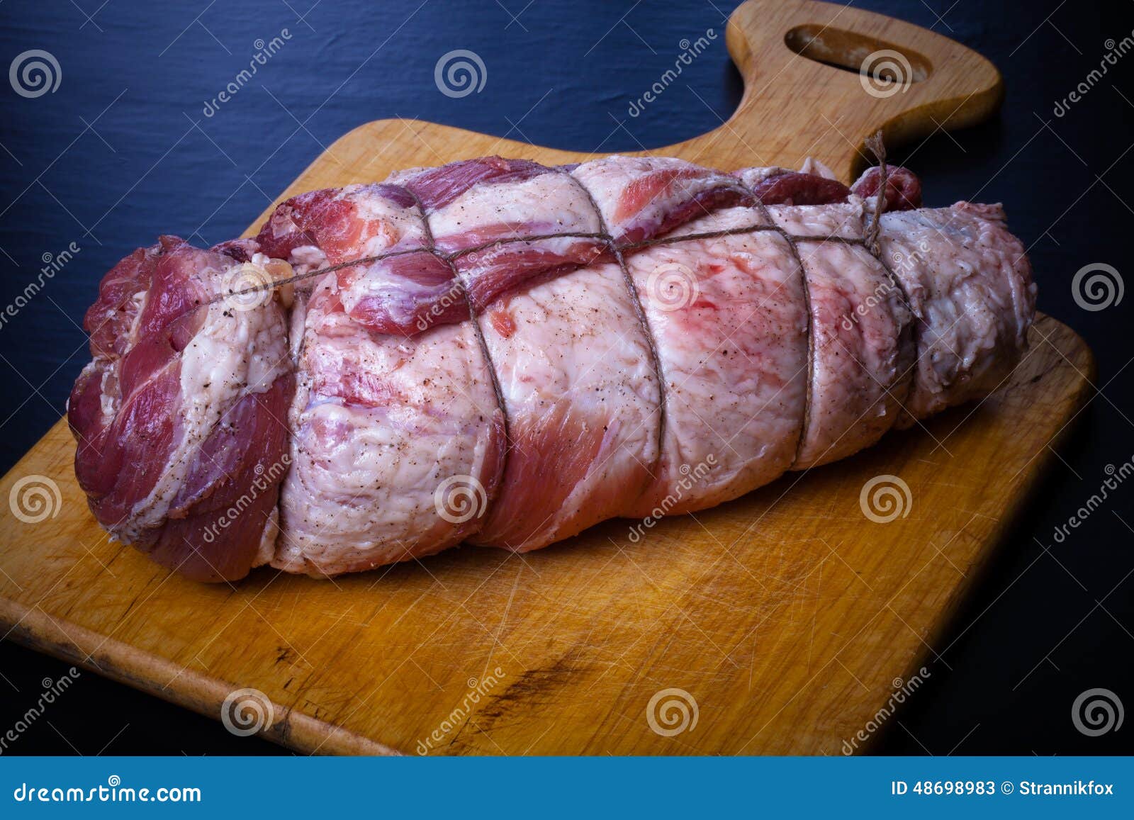Raw Meat with Rope on a Wooden Board. Toned Stock Image - Image of ...