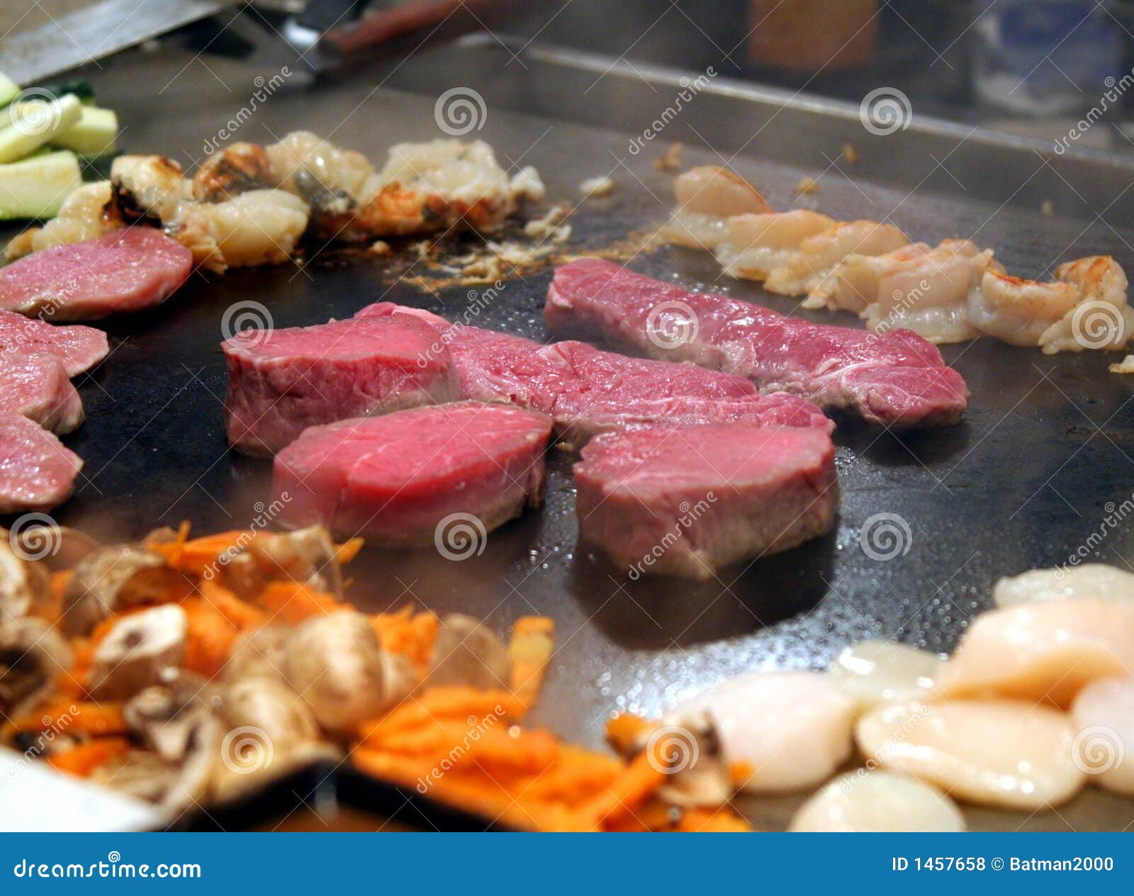 Raw meat on a stove stock photo. Image of exotic, restaurant - 1457658