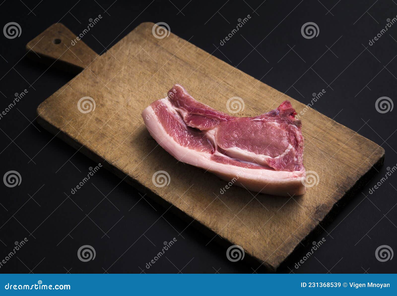 Raw Meat on Wooden Board and Black Background Stock Image - Image of ...
