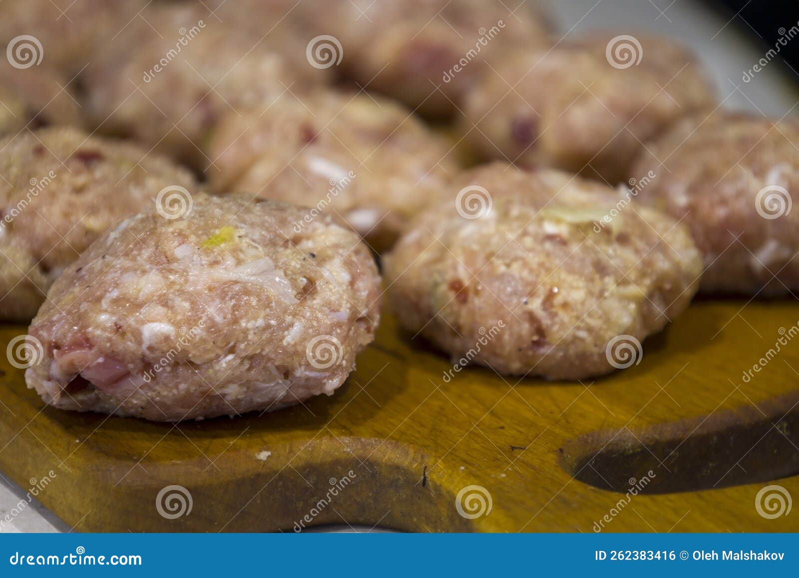 Raw meatballs on the board stock photo. Image of delicious - 262383416