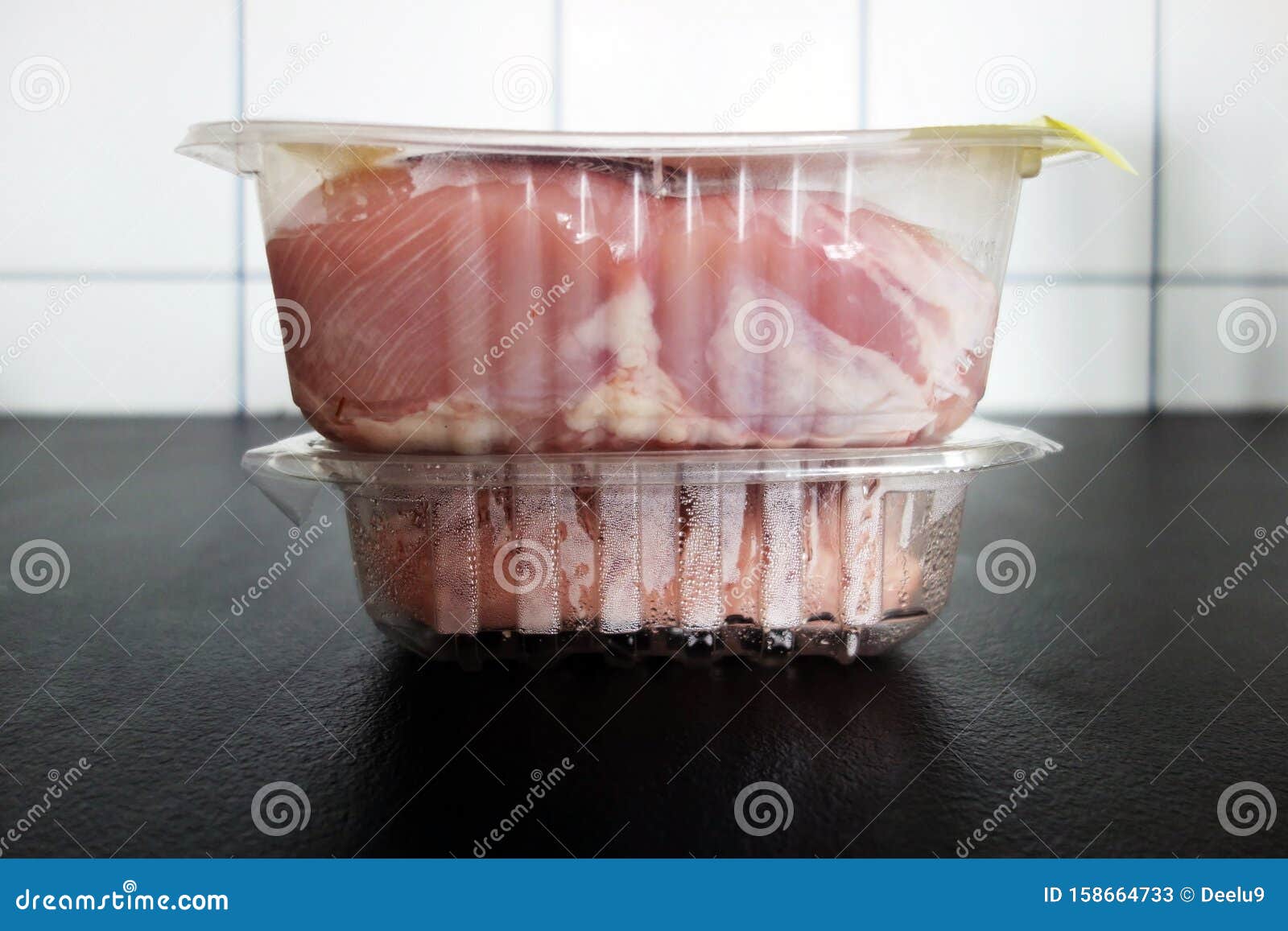Raw Meat Packed into Single-use Plastic Boxes on Counter Top in the ...