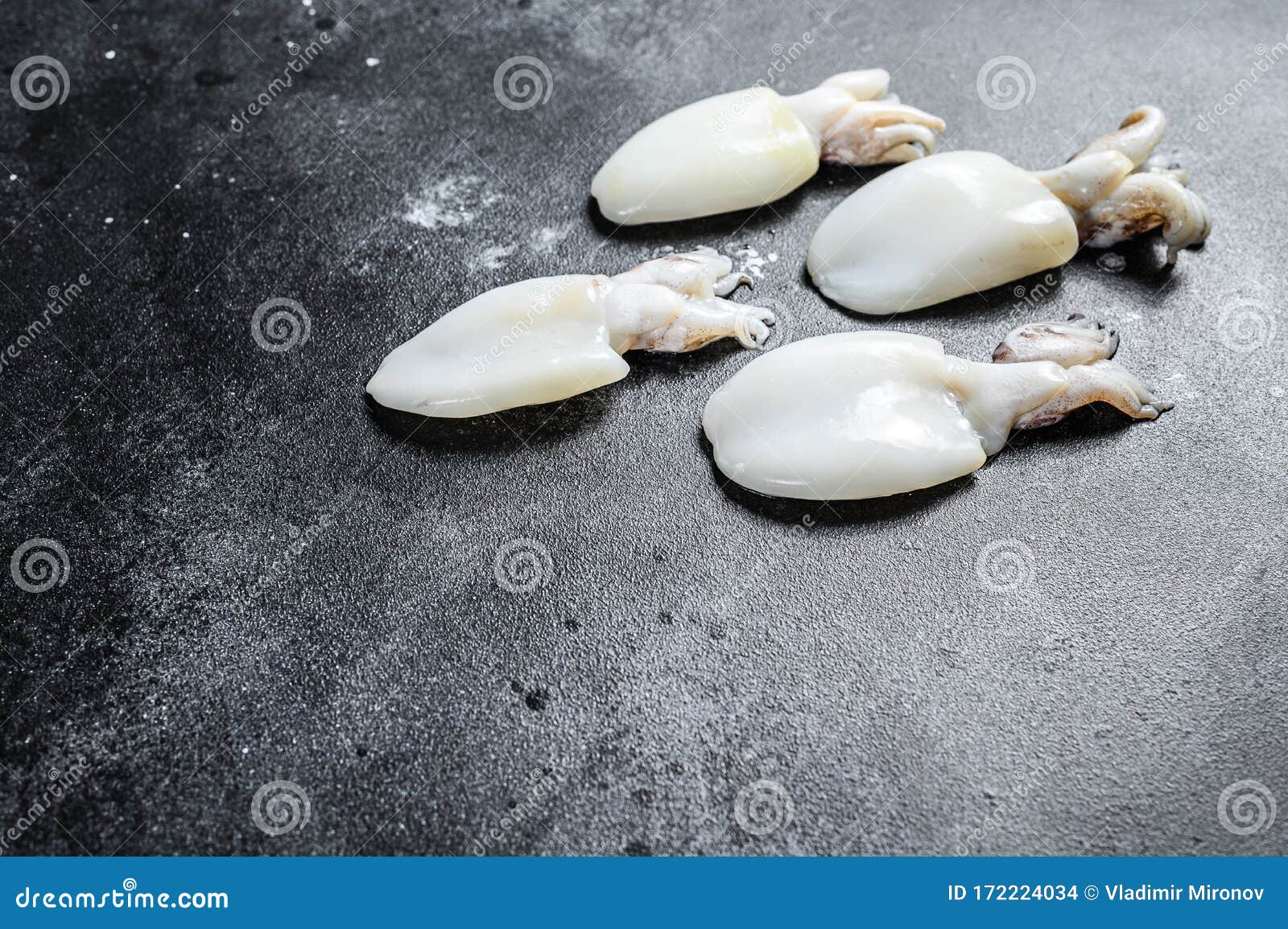Raw Mini Cuttlefish on the Table. Black Background. Top View Stock ...