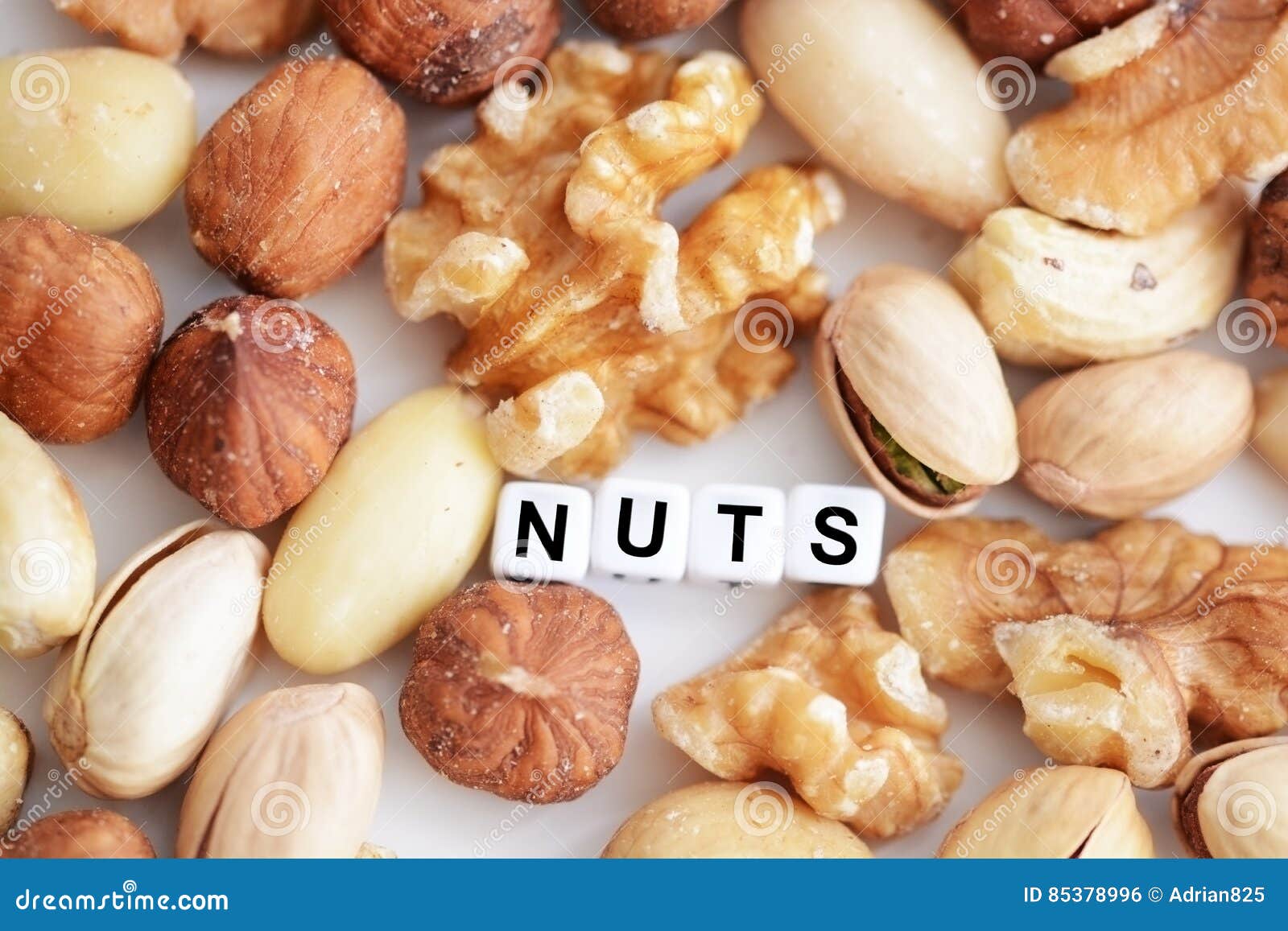 Raw Mixed Nuts and the Word â€œnutsâ€ Spelled by Tiled Letter Beads ...