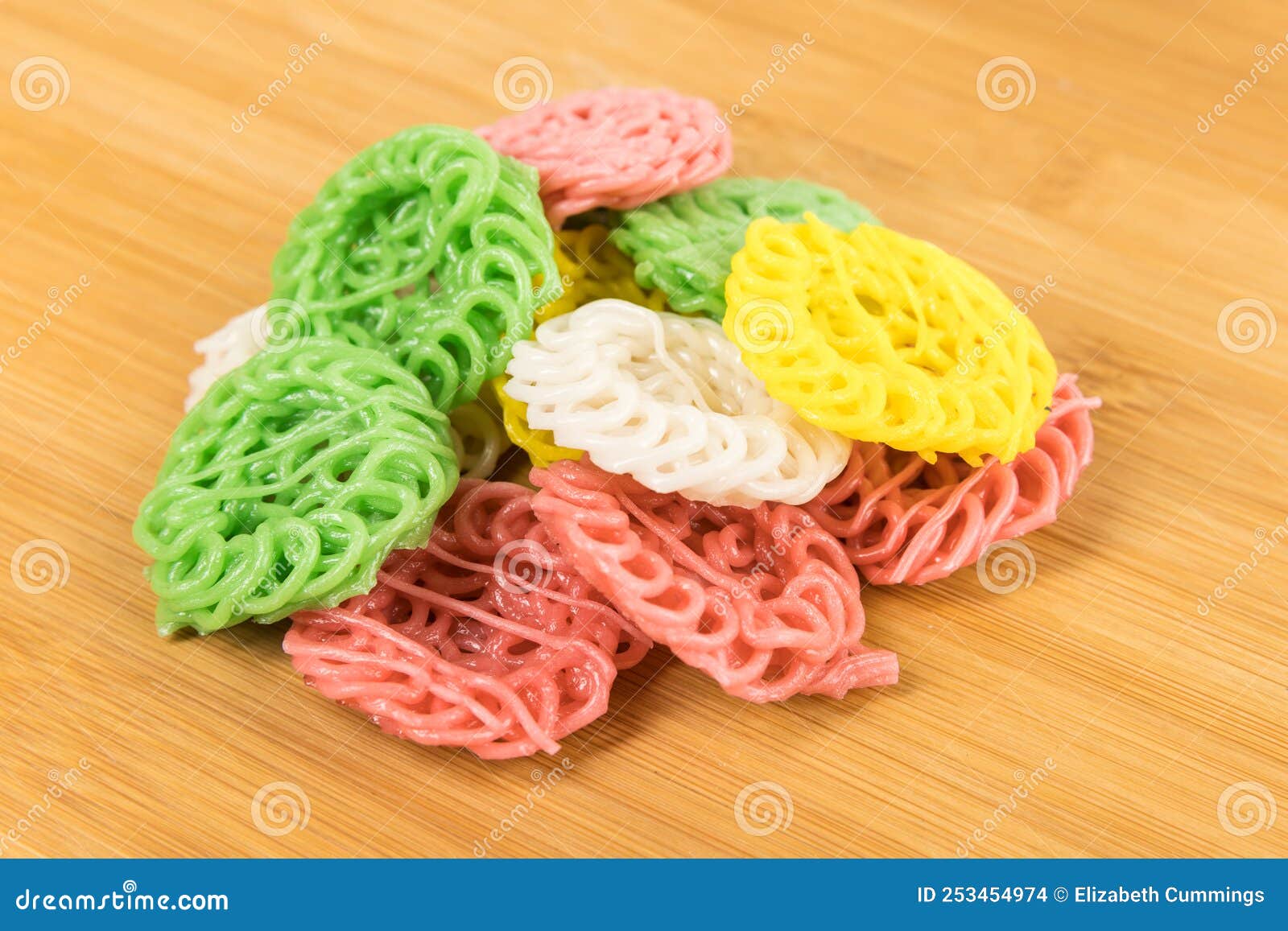 Raw Multicolored Tapioca Crackers on a Cutting Board Isolated Over ...
