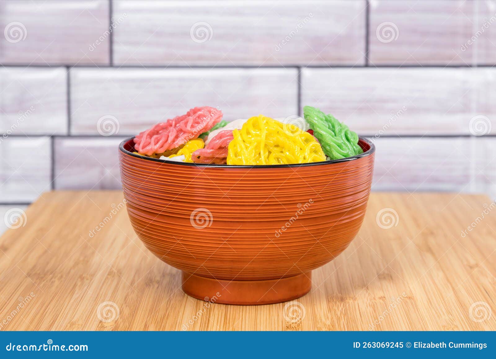 Raw Multicolored Tapioca Crackers in an Orange Bowl Stock Image - Image ...
