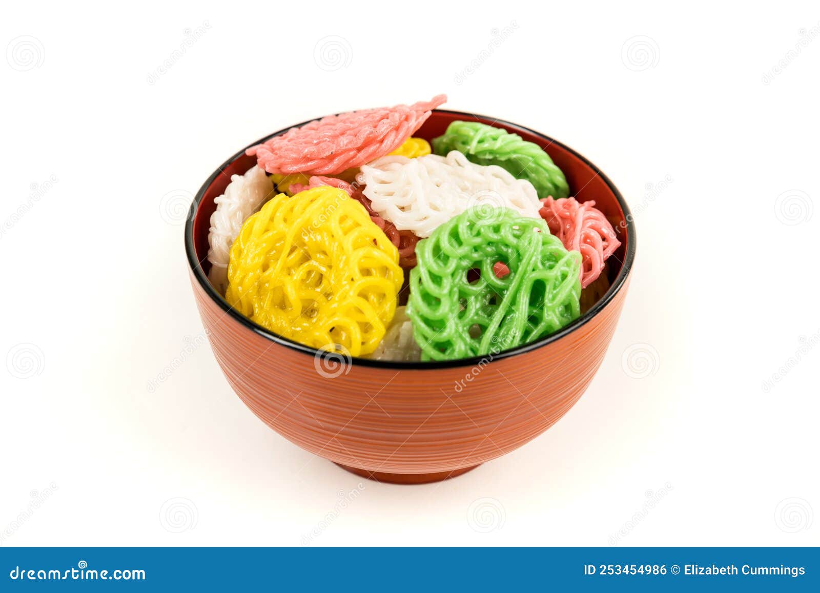 Raw Multicolored Tapioca Crackers in an Orange Bowl Isolated Over White ...