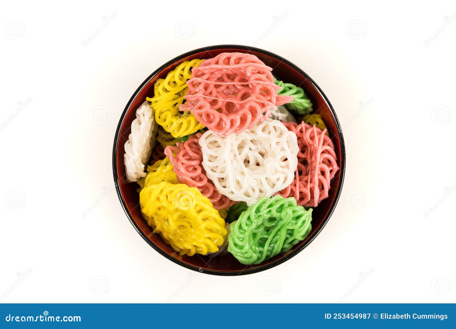 Raw Multicolored Tapioca Crackers in an Orange Bowl Top Down Isolated ...