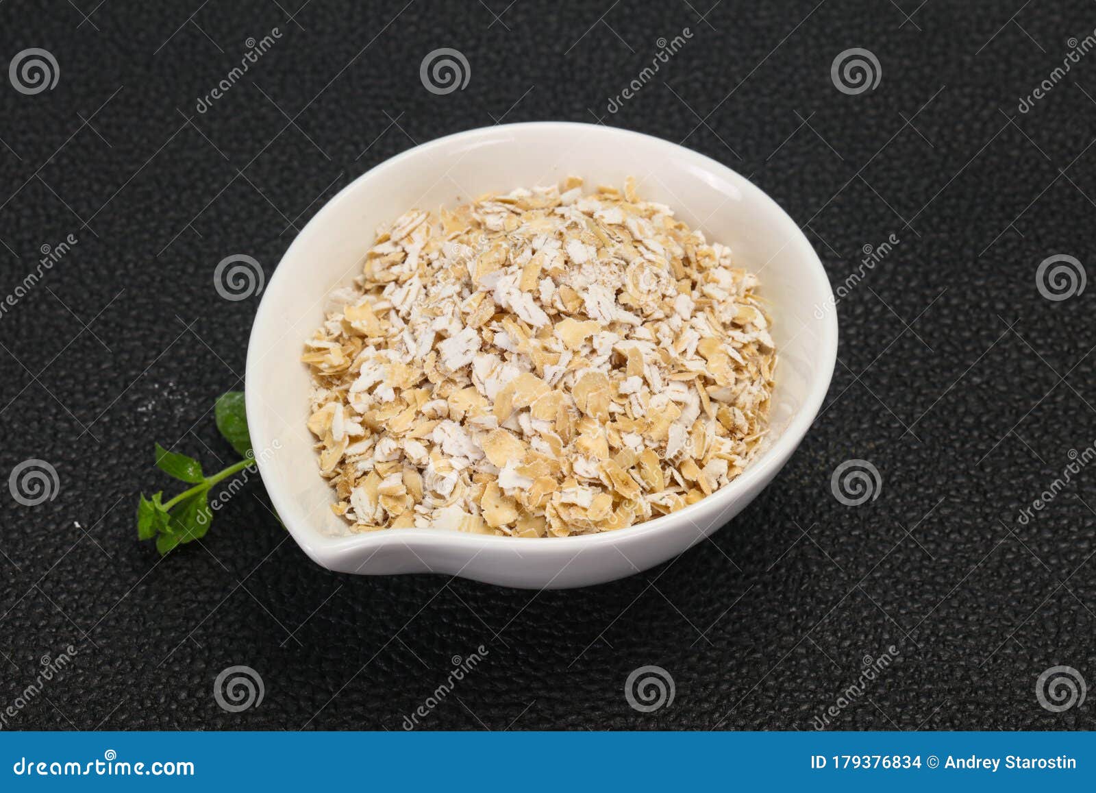 Raw oats in the bowl stock photo. Image of breakfast - 179376834