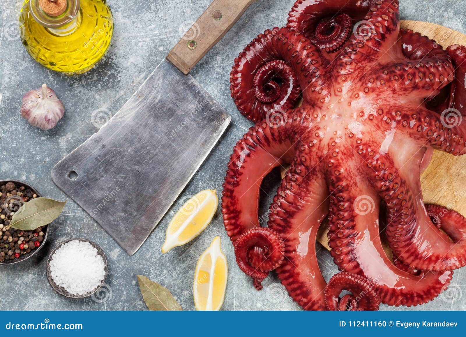 Raw octopus cooking stock photo. Image of food, cutting - 112411160
