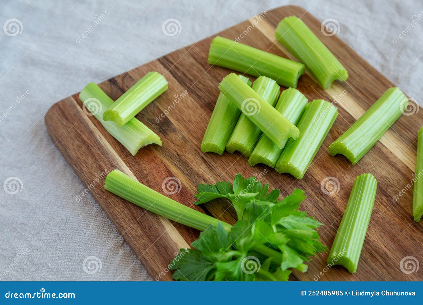 Raw Organic Celery on a Wooden Board, Side View. Close-up Stock Image ...