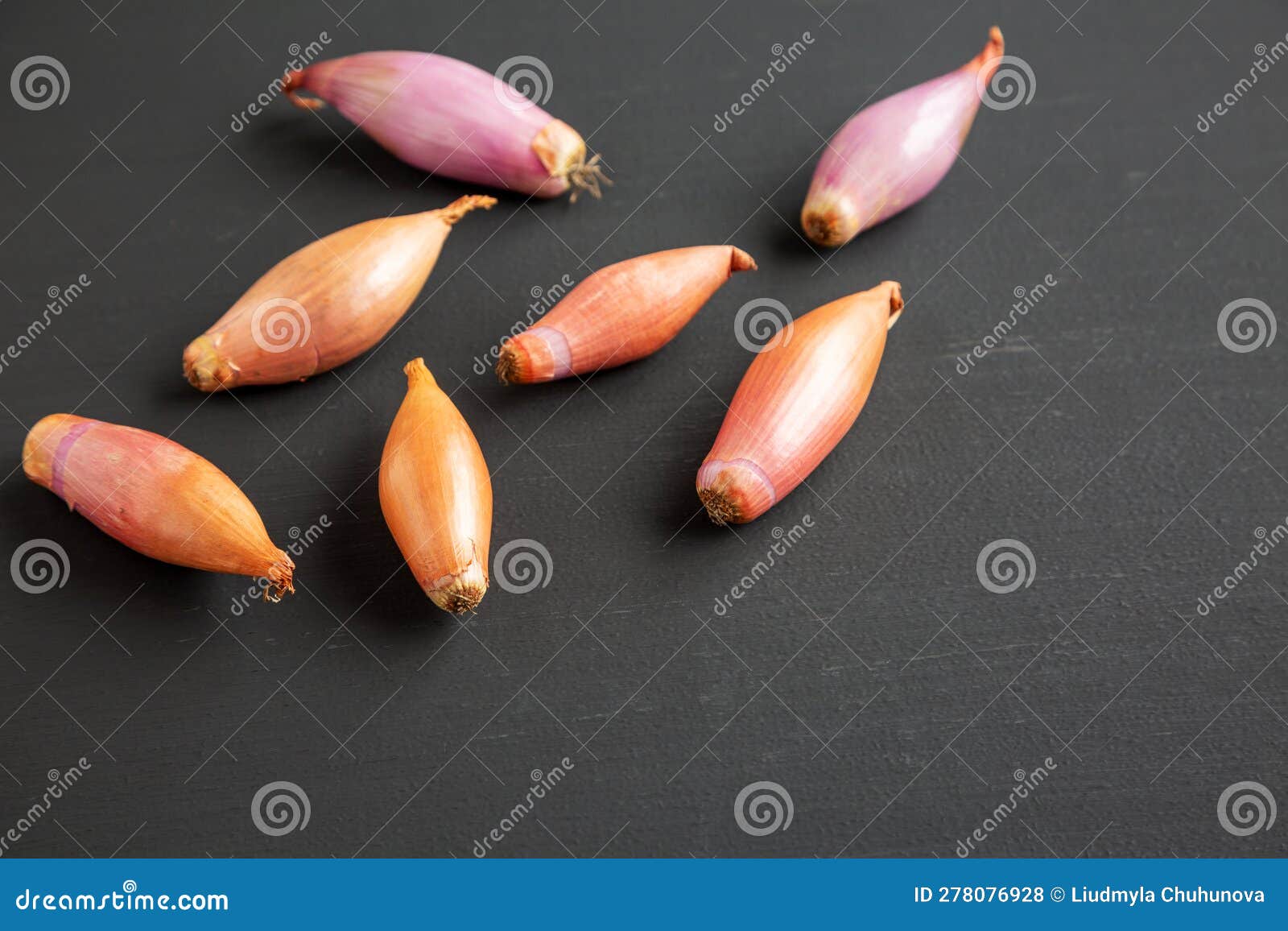 Raw Organic Shallots on a Black Background, Side View Stock Photo ...