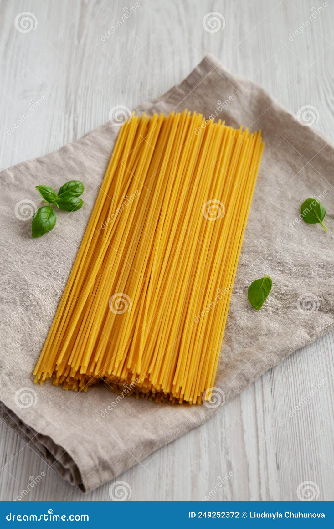 Raw Organic Spaghetti Pasta in a Bunch, Side View Stock Photo - Image ...
