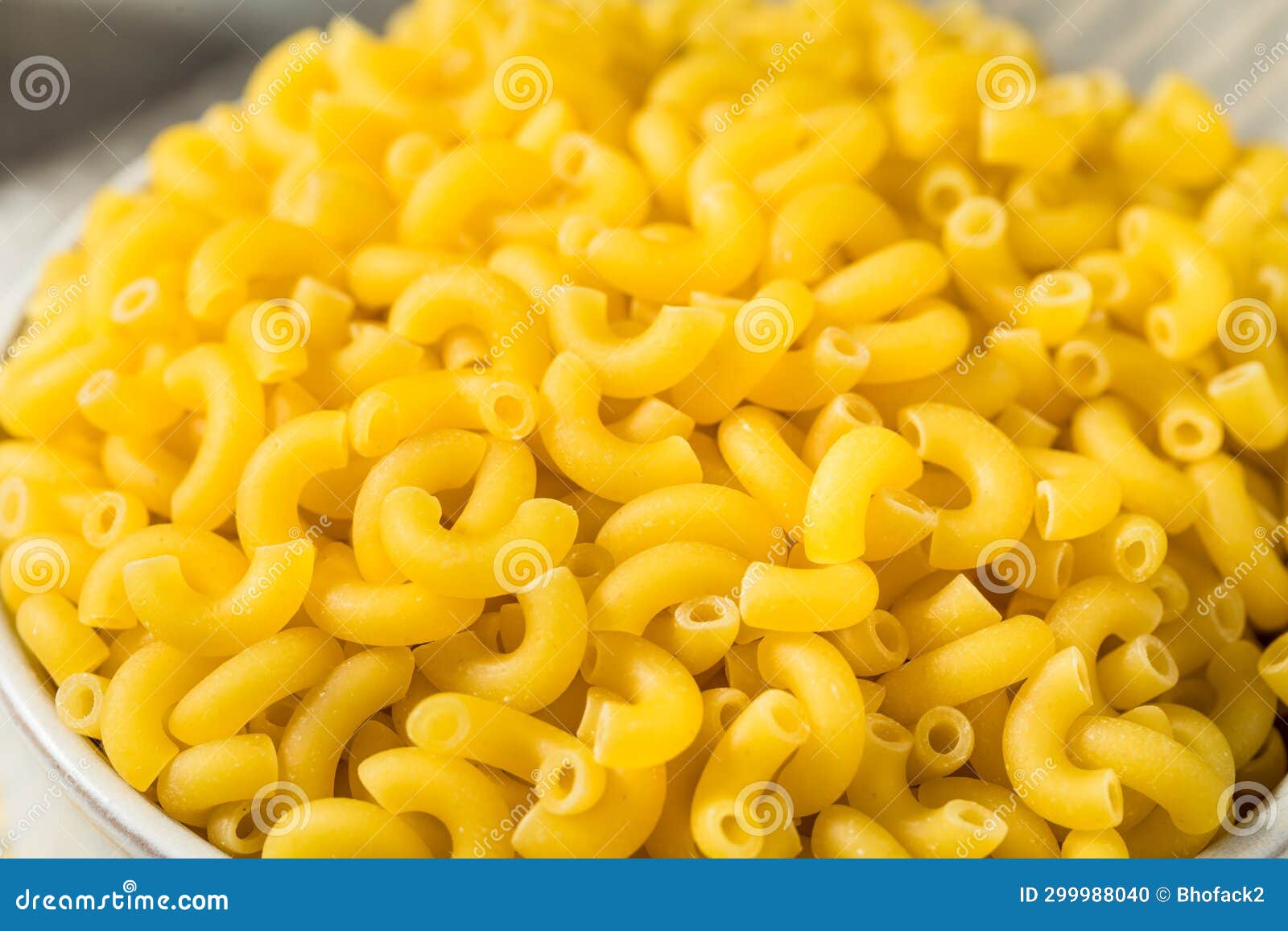 Raw Organic Uncooked Macaroni Noodles Stock Photo - Image of ...