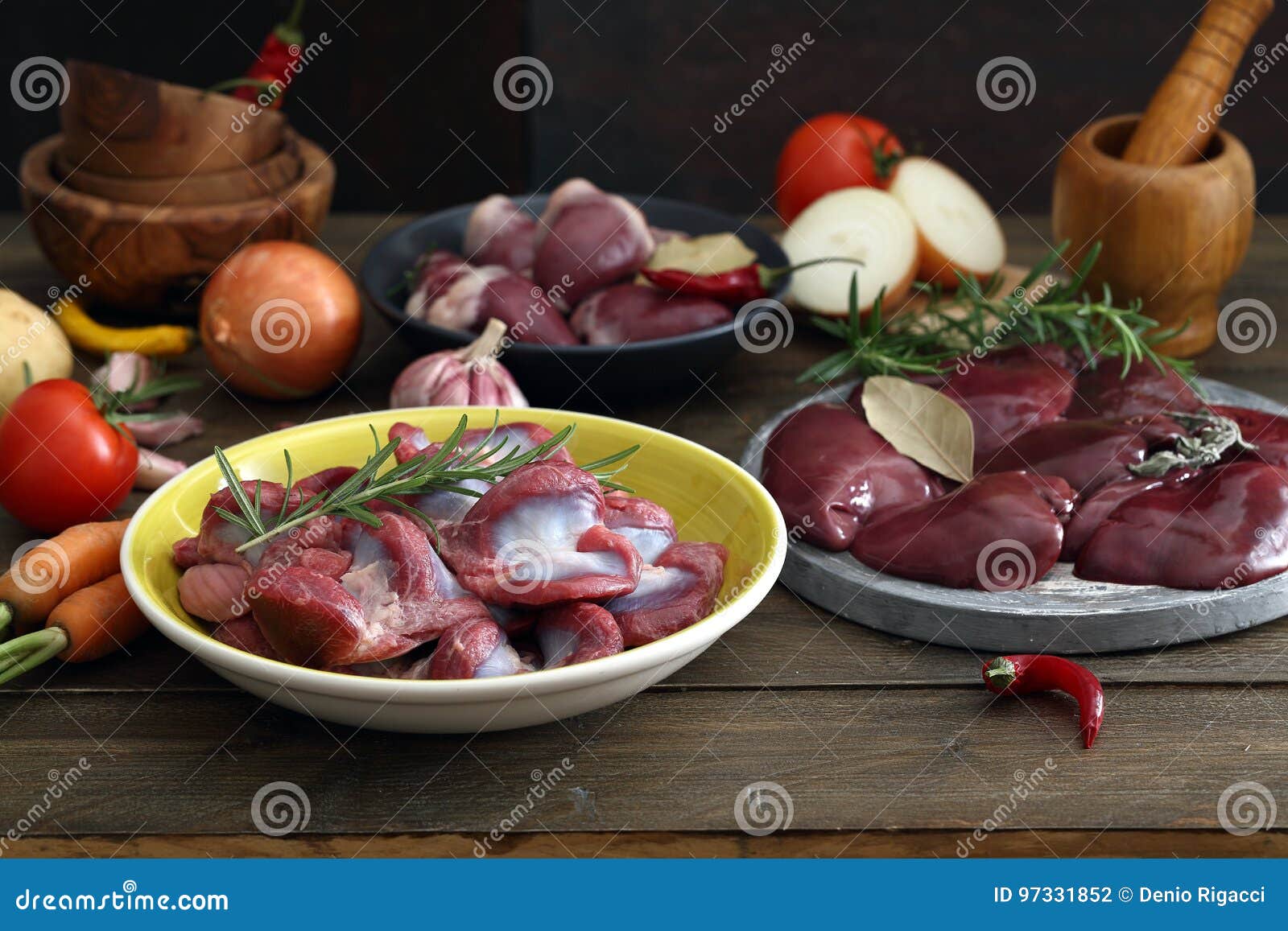 Raw organs and vegetables stock photo. Image of poultry - 97331852