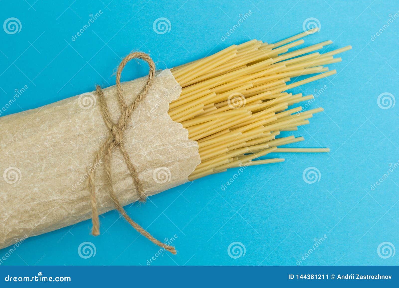 Raw Pasta on a Blue Background in a Rustic Package Stock Image - Image ...