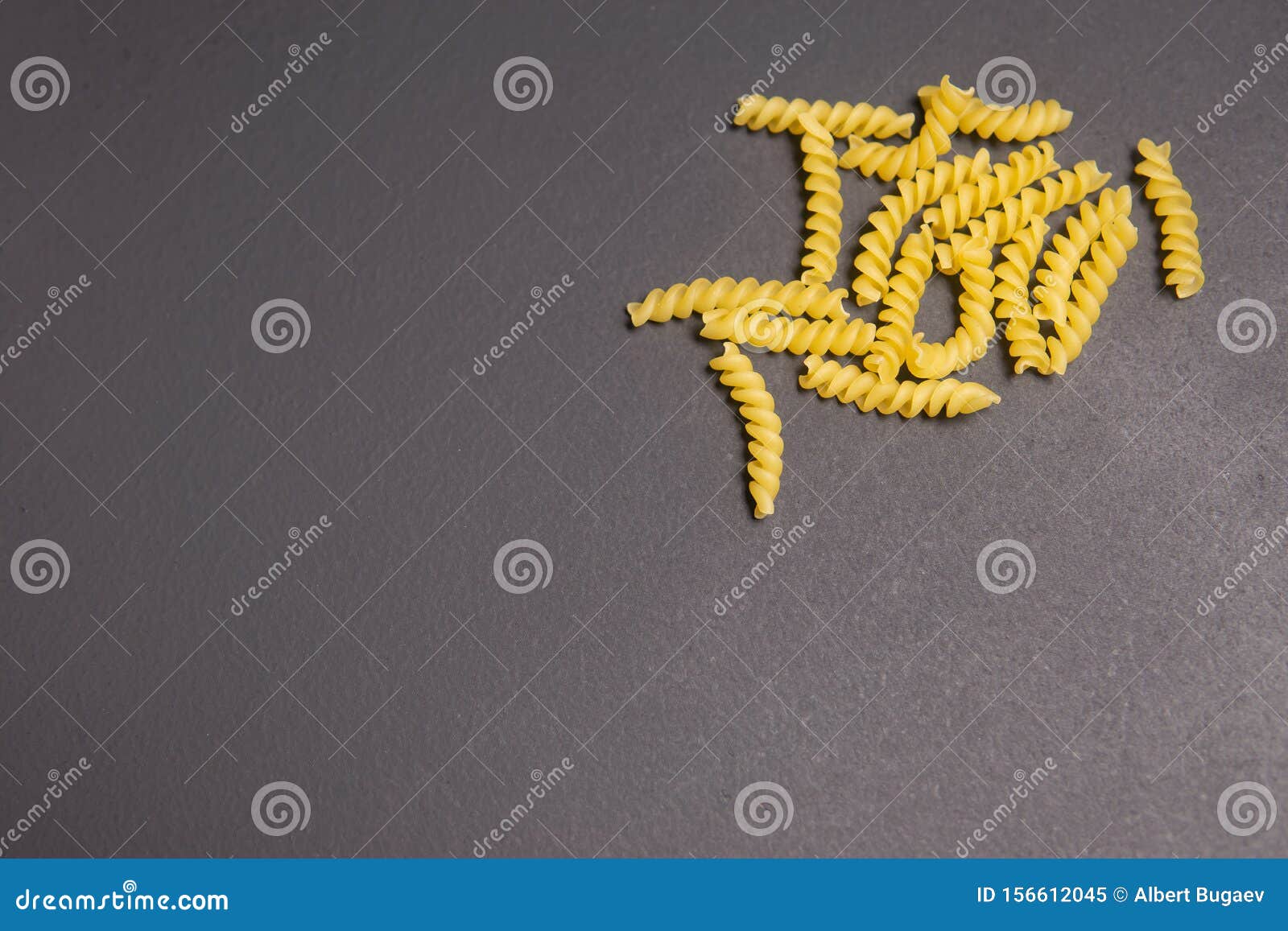Raw Pasta in the Form of a Spiral on Grey Background Stock Image ...