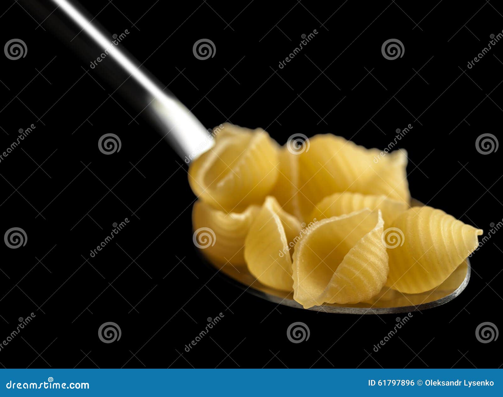 Raw pasta in spoon closeup stock photo. Image of wheat - 61797896