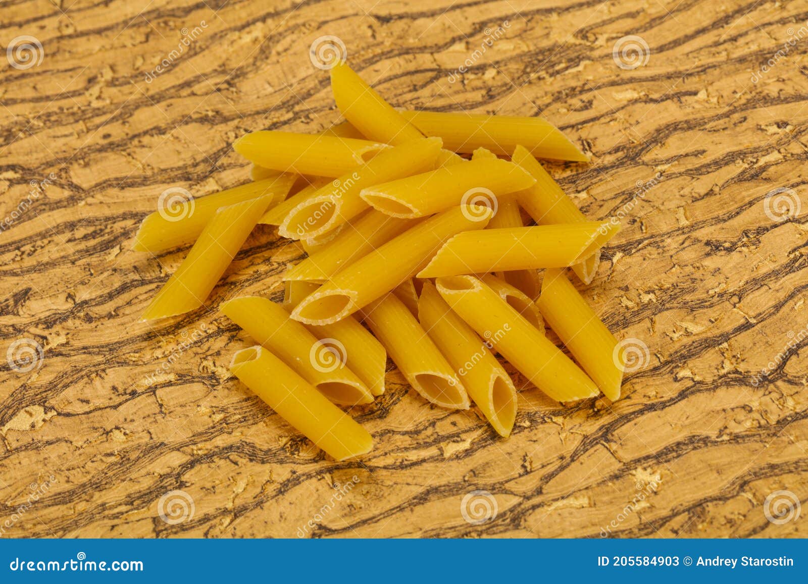 Raw penne pasta for bowl stock image. Image of uncooked - 205584903
