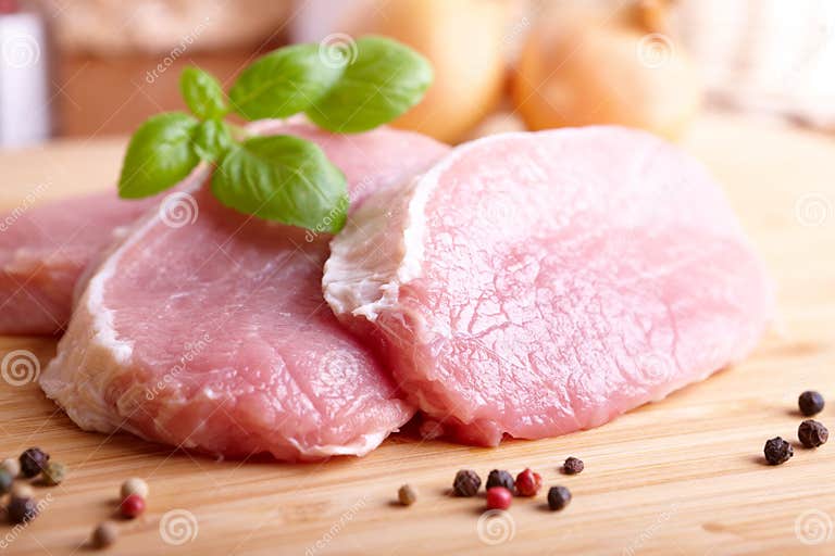 Raw Pork Chops on Cutting Board Stock Photo - Image of chopped ...