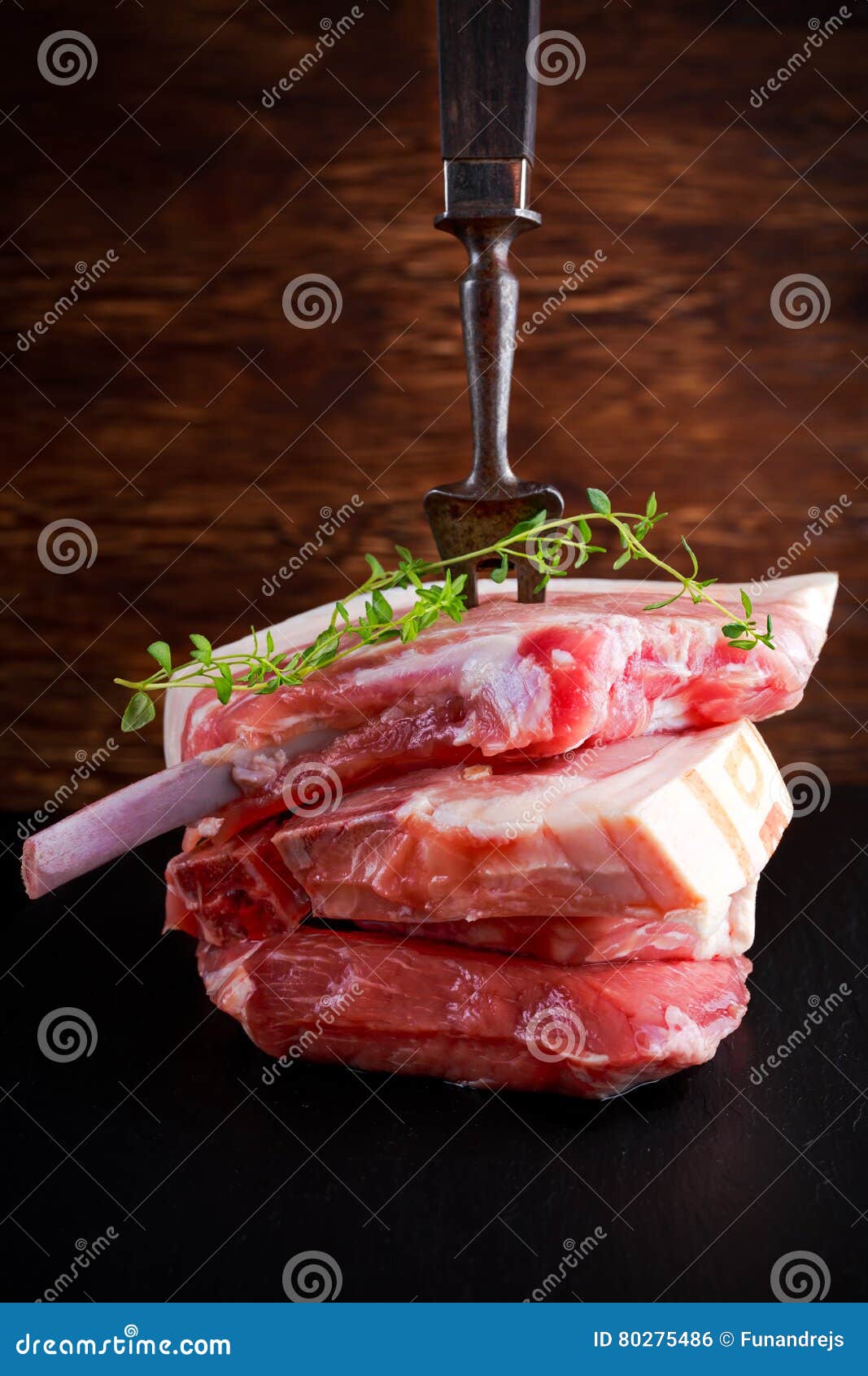 Raw Pork Cutlets Stabbed with Old Steak Fork Stock Photo - Image of ...