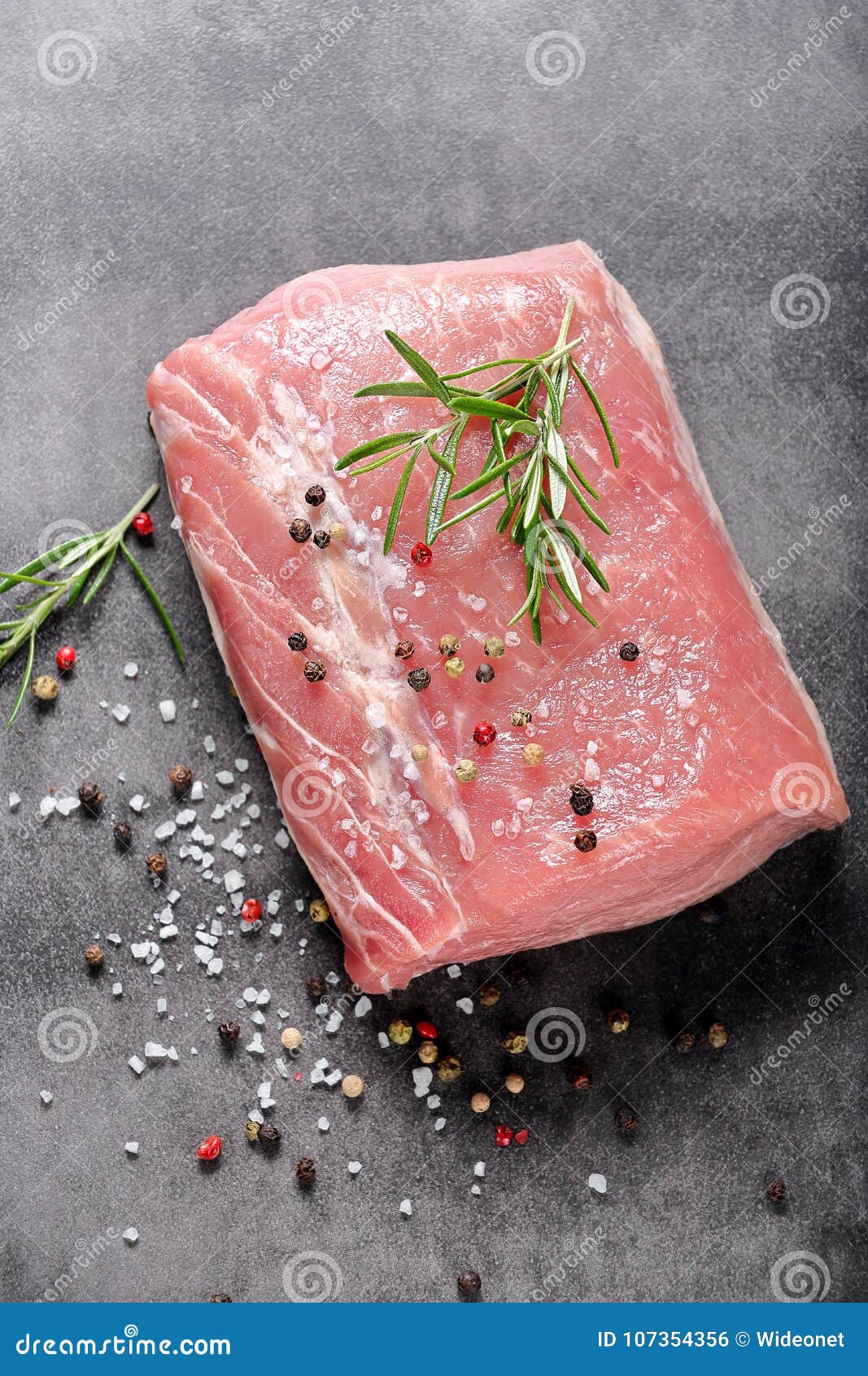 Raw pork loin with spices stock photo. Image of fillet - 107354356