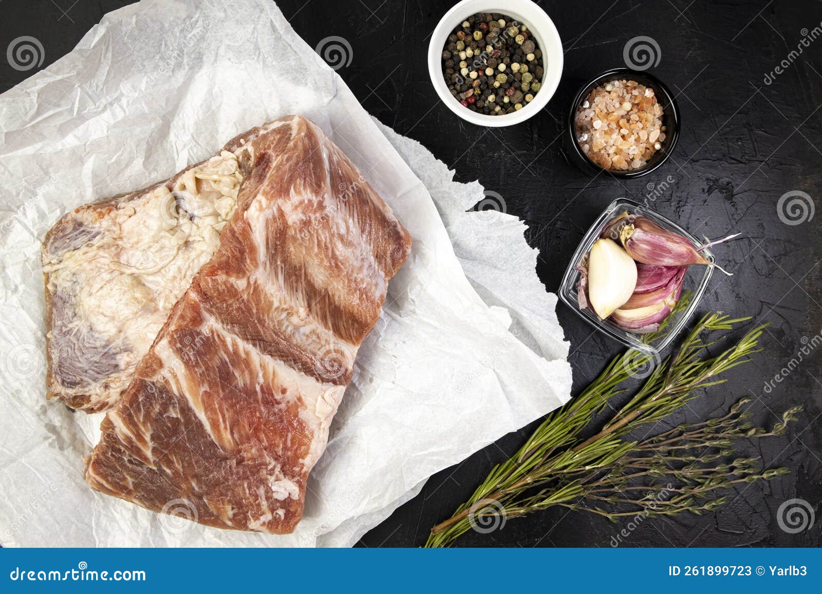 Raw Pork Ribs on Wrapping Paper on a Cutting Table with Spices and ...