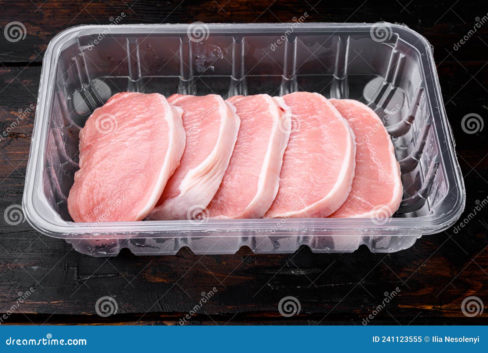 Raw Pork Steak Meat, in Plastic Pack Container, on Old Dark Wooden ...