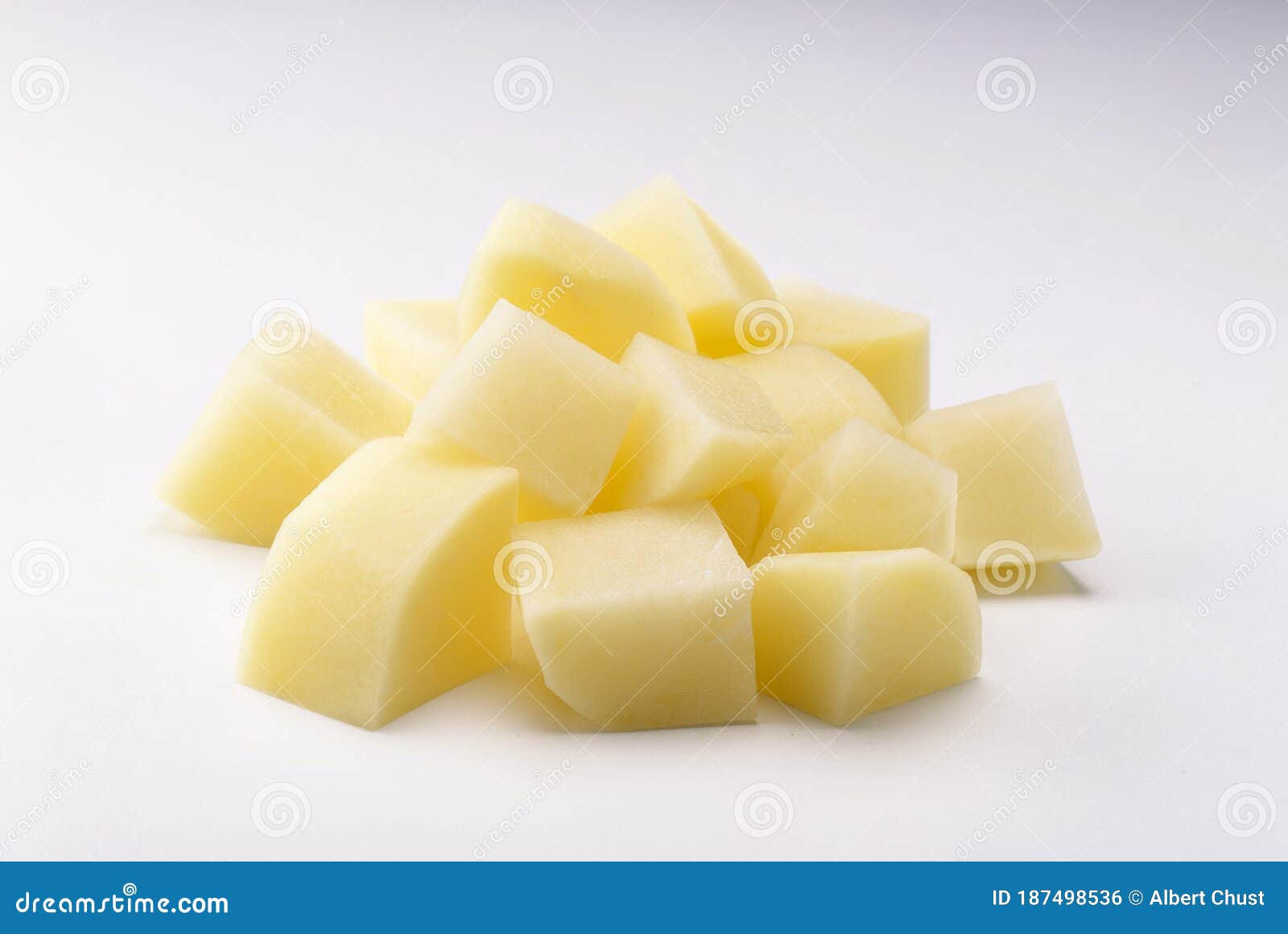 Raw Potato Cut into Square Pieces on White Background Stock Photo ...