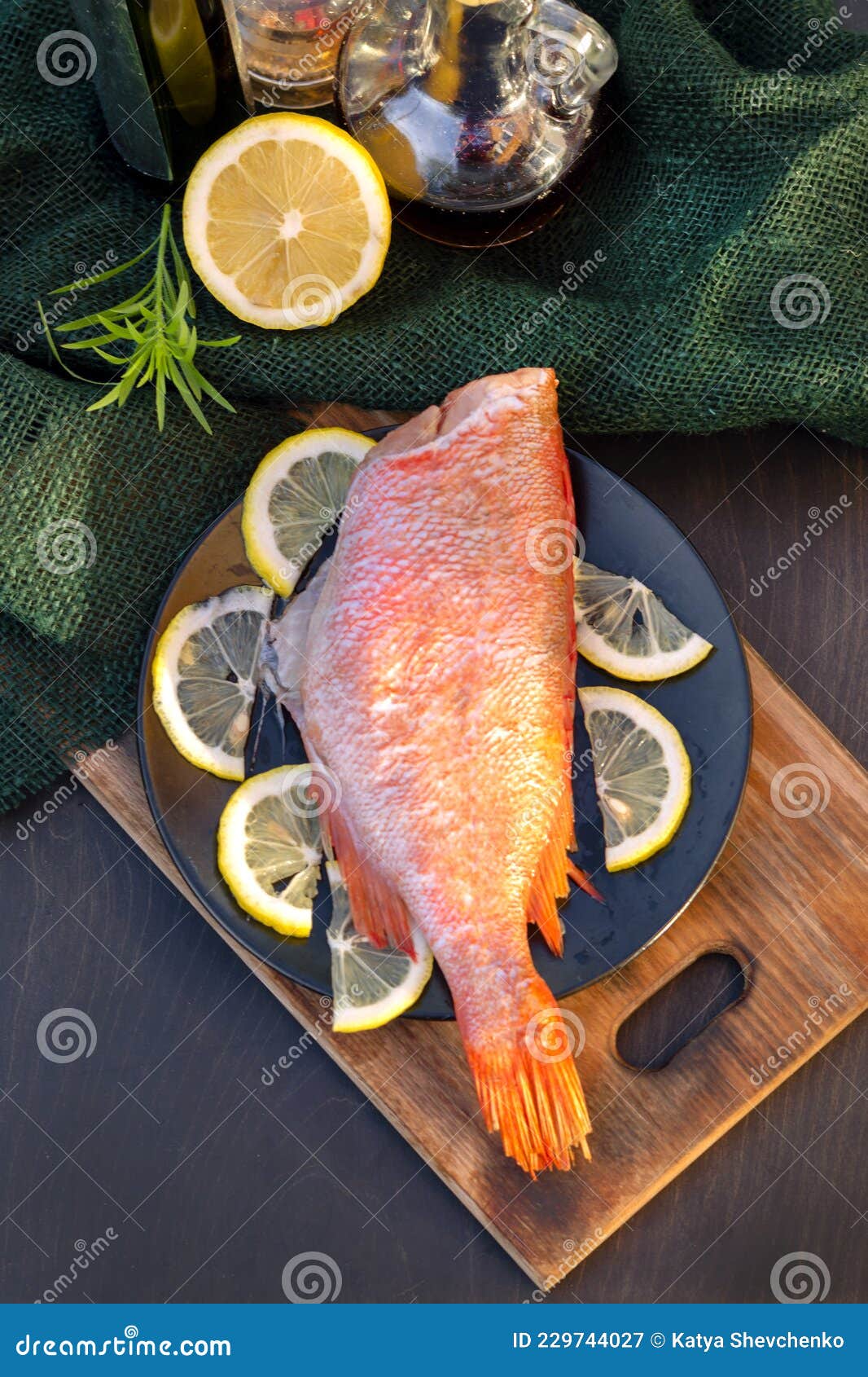 Raw Red Snapper on a Plate with Lemon Stock Image - Image of olive ...