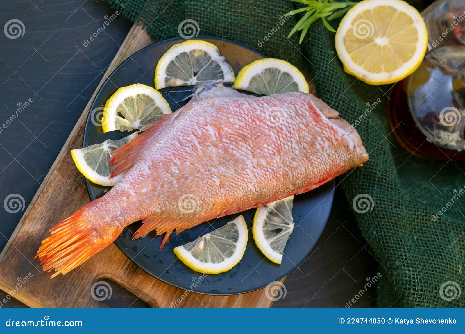 Raw Red Snapper on a Plate with Lemon Stock Photo - Image of fresh ...