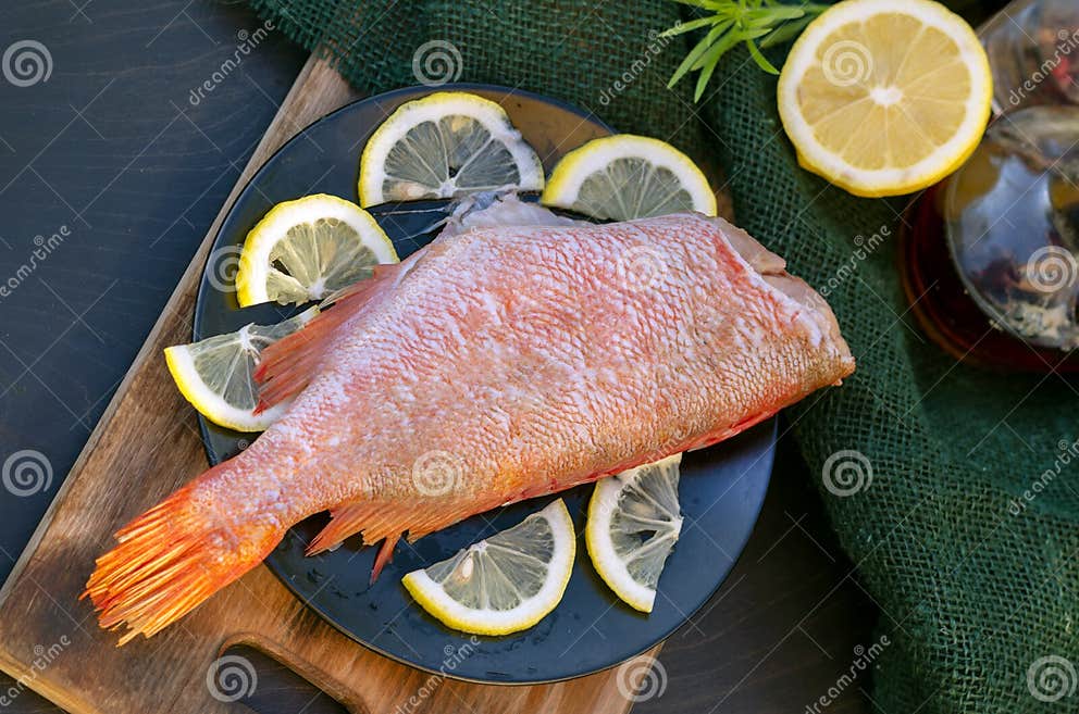 Raw Red Snapper on a Plate with Lemon Stock Photo - Image of fresh ...