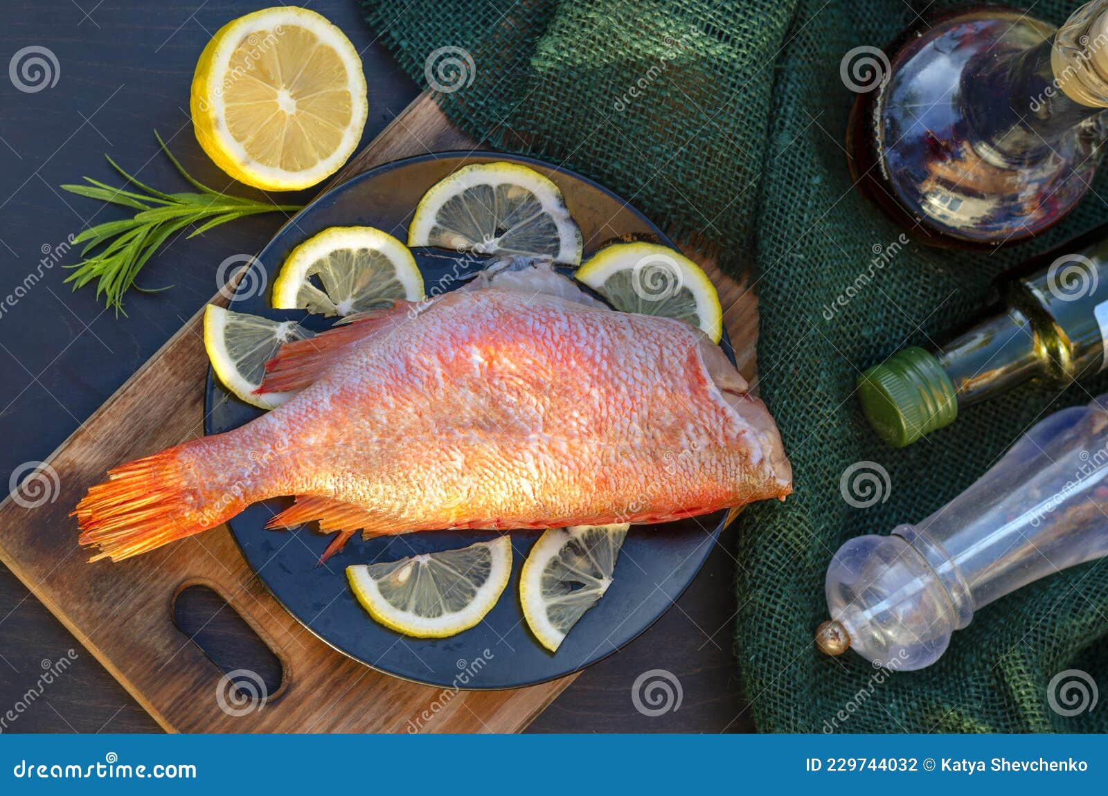 Raw Red Snapper on a Plate with Lemon Stock Photo - Image of dish ...