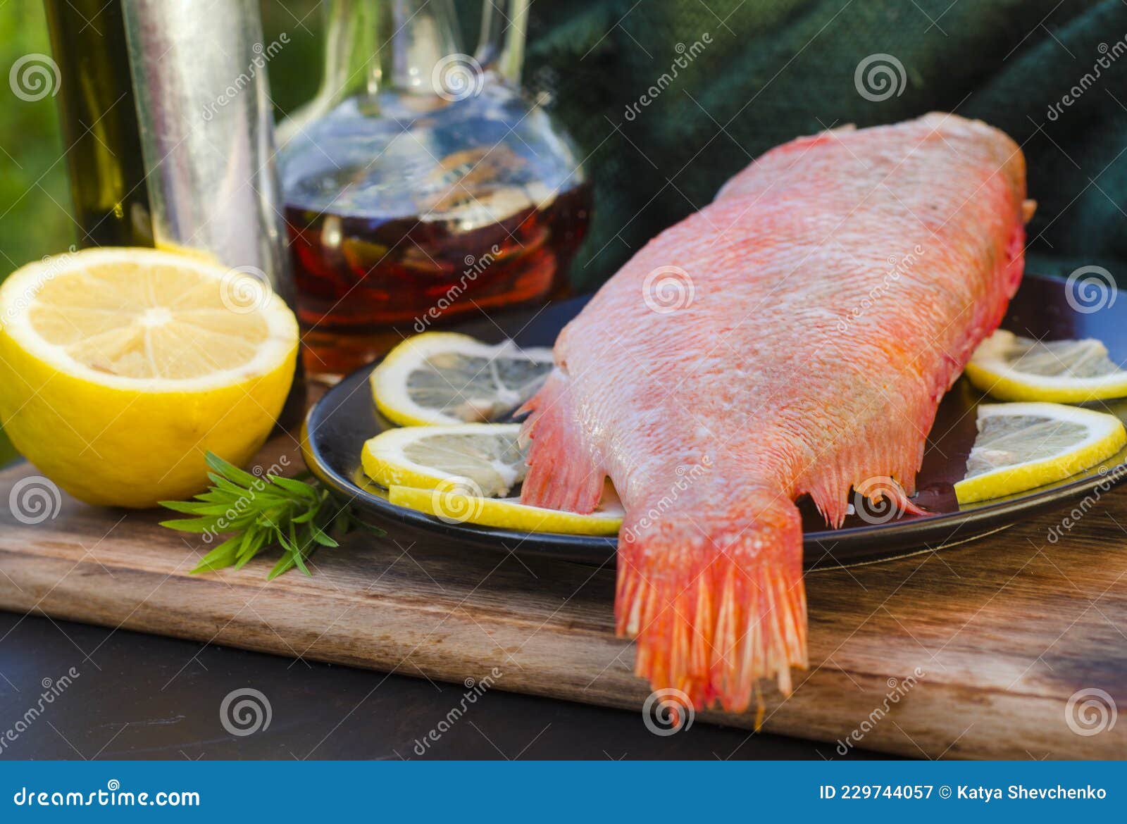 Raw Red Snapper on a Plate with Lemon Stock Image - Image of rosemary ...