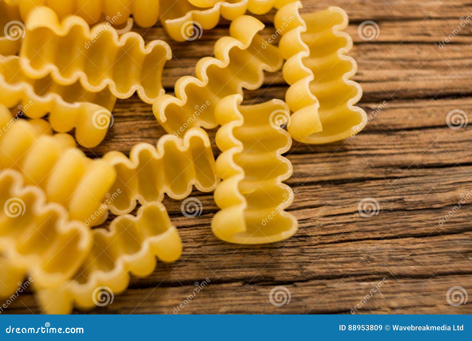 Raw Riccioli Pasta on Wooden Surface Stock Image - Image of yellow ...