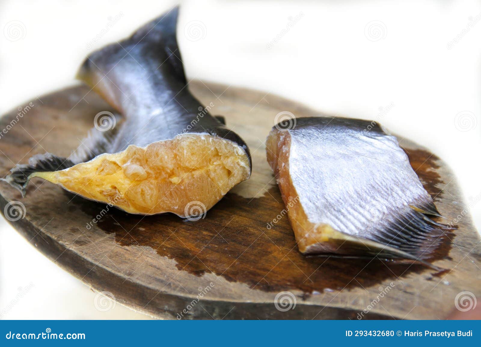 Raw Salted Fish on a Cutting Board Isolated on a White Background ...