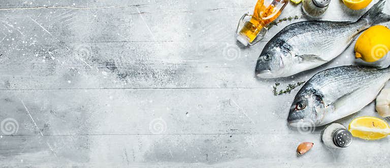 Raw Sea Fish with Lemon Wedges and Spices Stock Image - Image of olive ... Raw Sea Fish with Lemon Wedges and Spices Stock Image - Image of olive ...