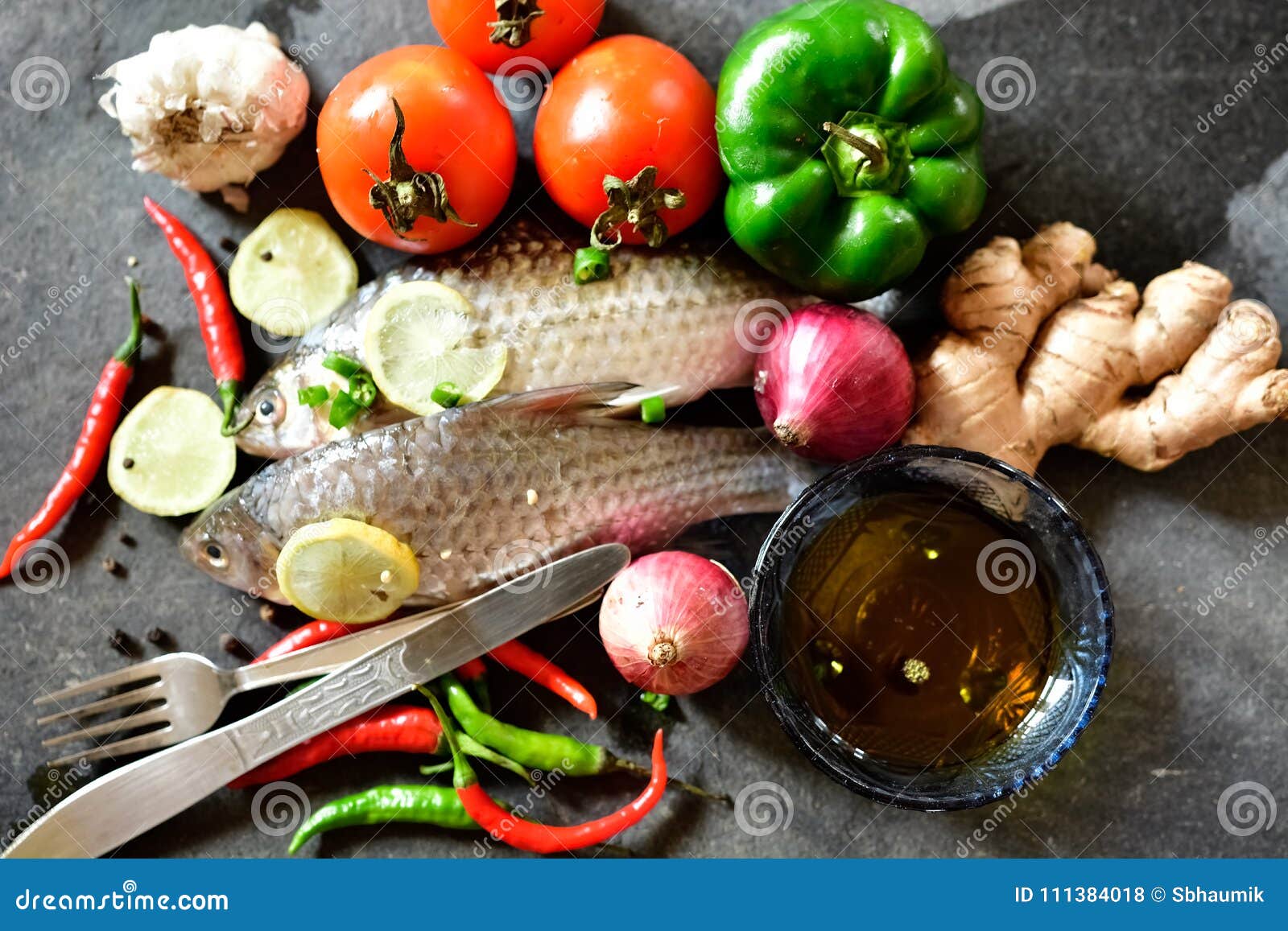 Raw sea fish on table stock photo. Image of saltwater - 111384018