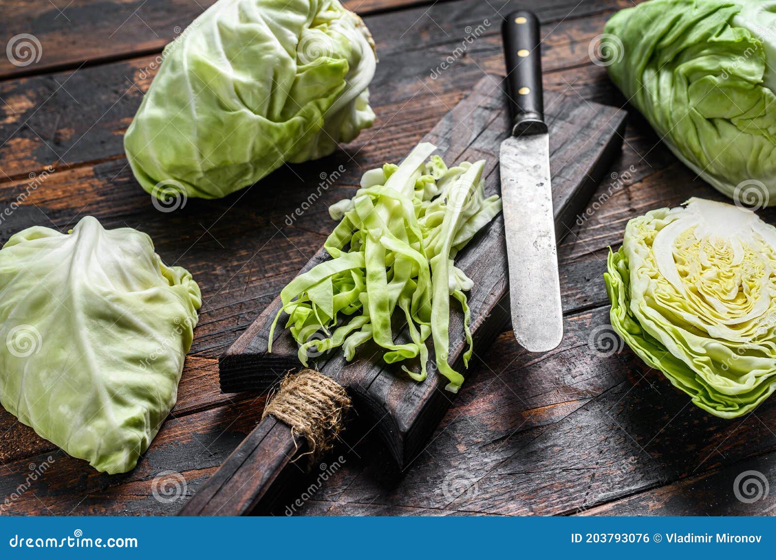 Raw Sliced Pointed White Cabbage on a Cutting Board. Wooden Background ...