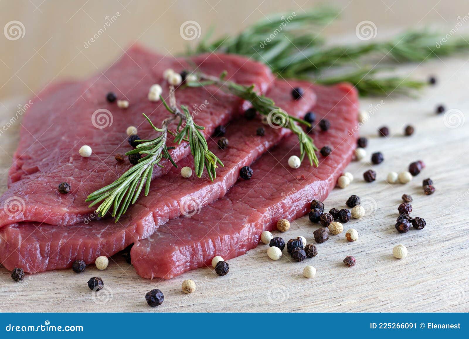 Raw Slices of Lean Beef with Pepper and Rosemary Stock Image - Image of ...