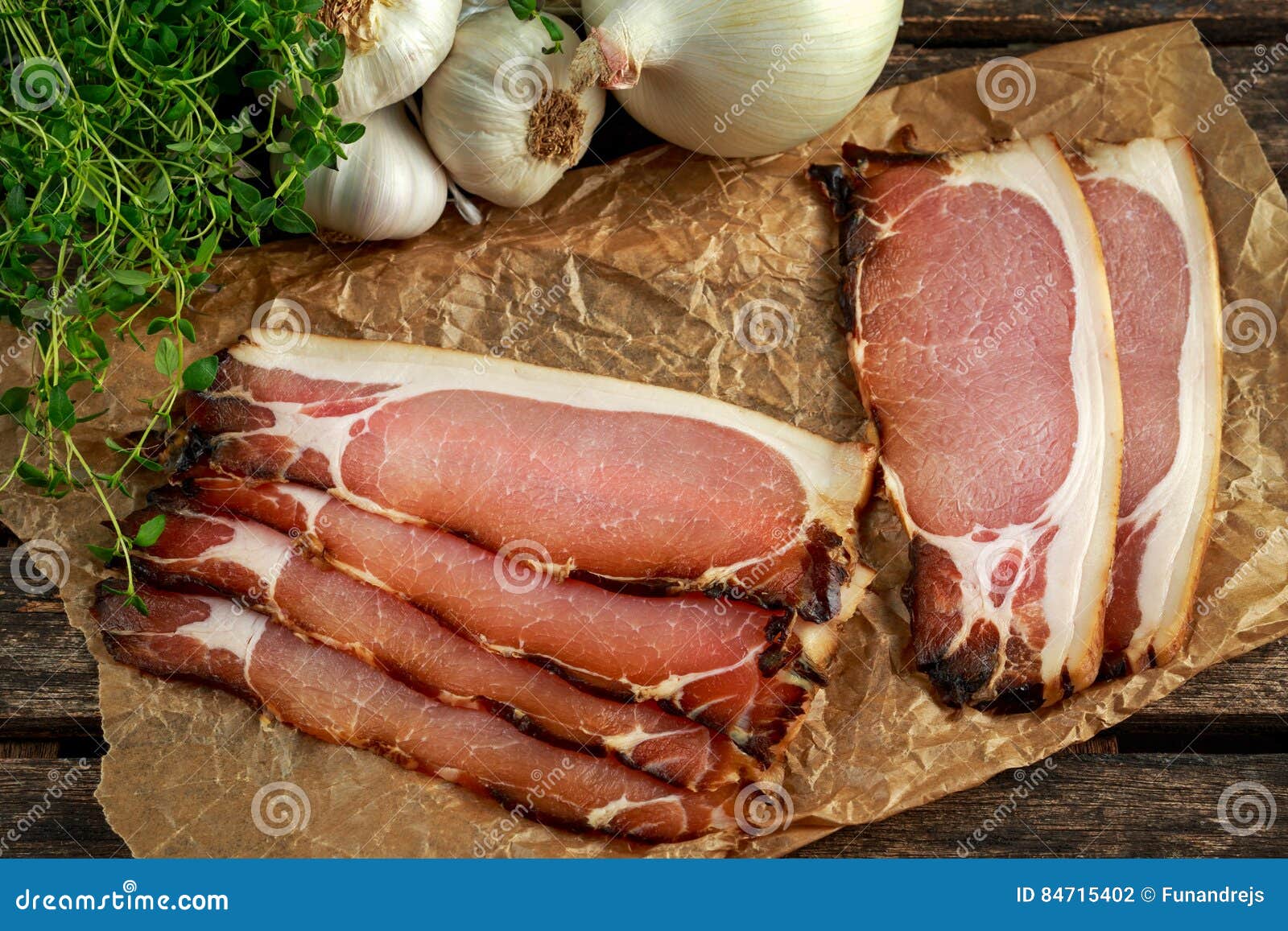 Raw Smoked Sliced Bacon on Crumpled Paper Stock Photo - Image of ...