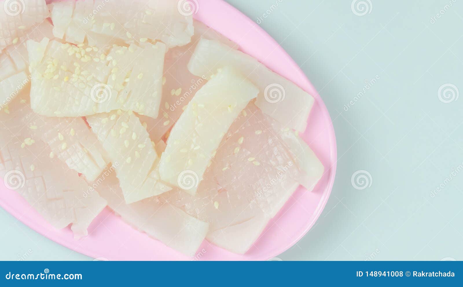 Raw Squid Sliced on Pink Plate Stock Photo - Image of uncooked, plate ...