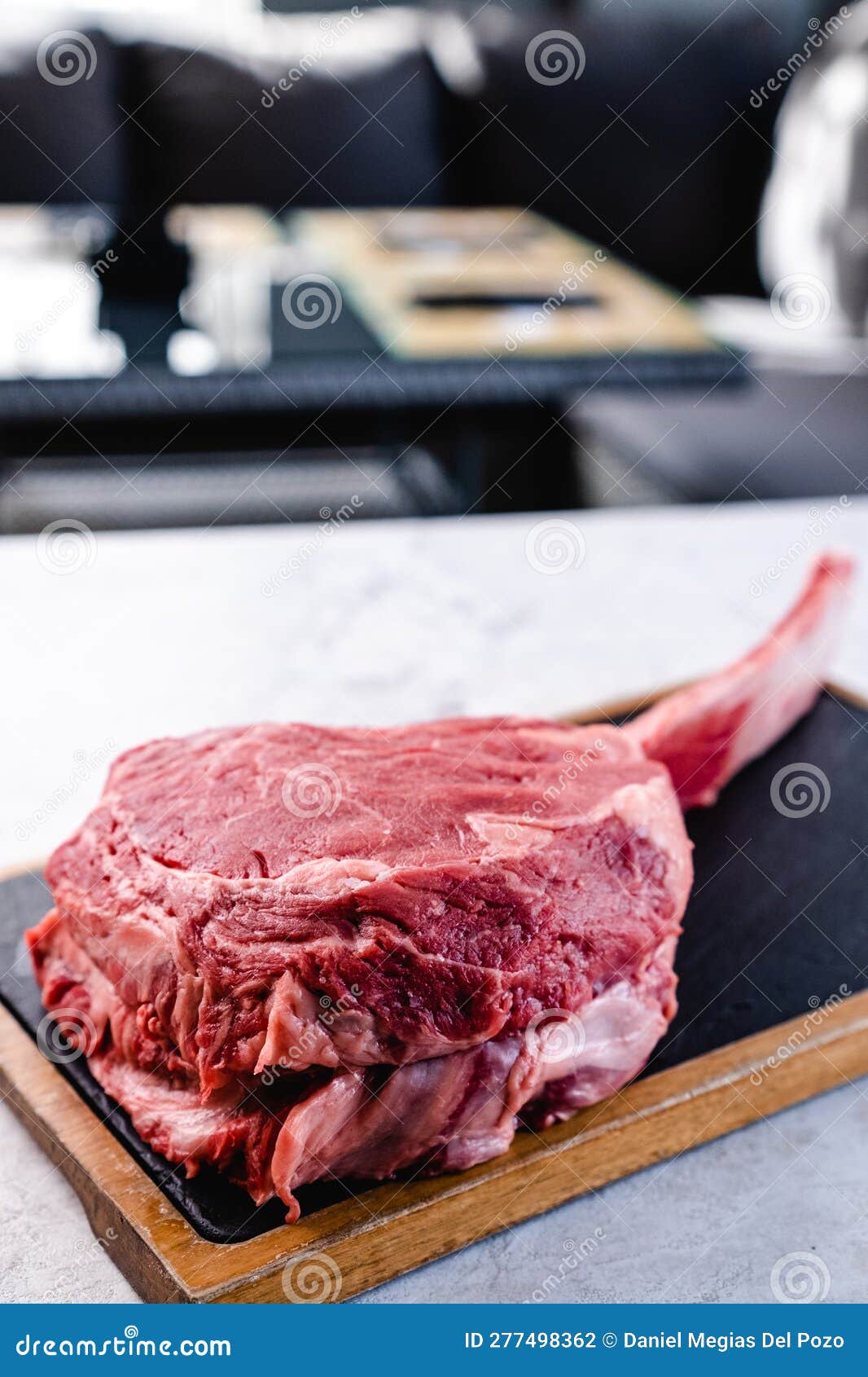 Raw tomahawk steak on tray stock photo. Image of fresh - 277498362