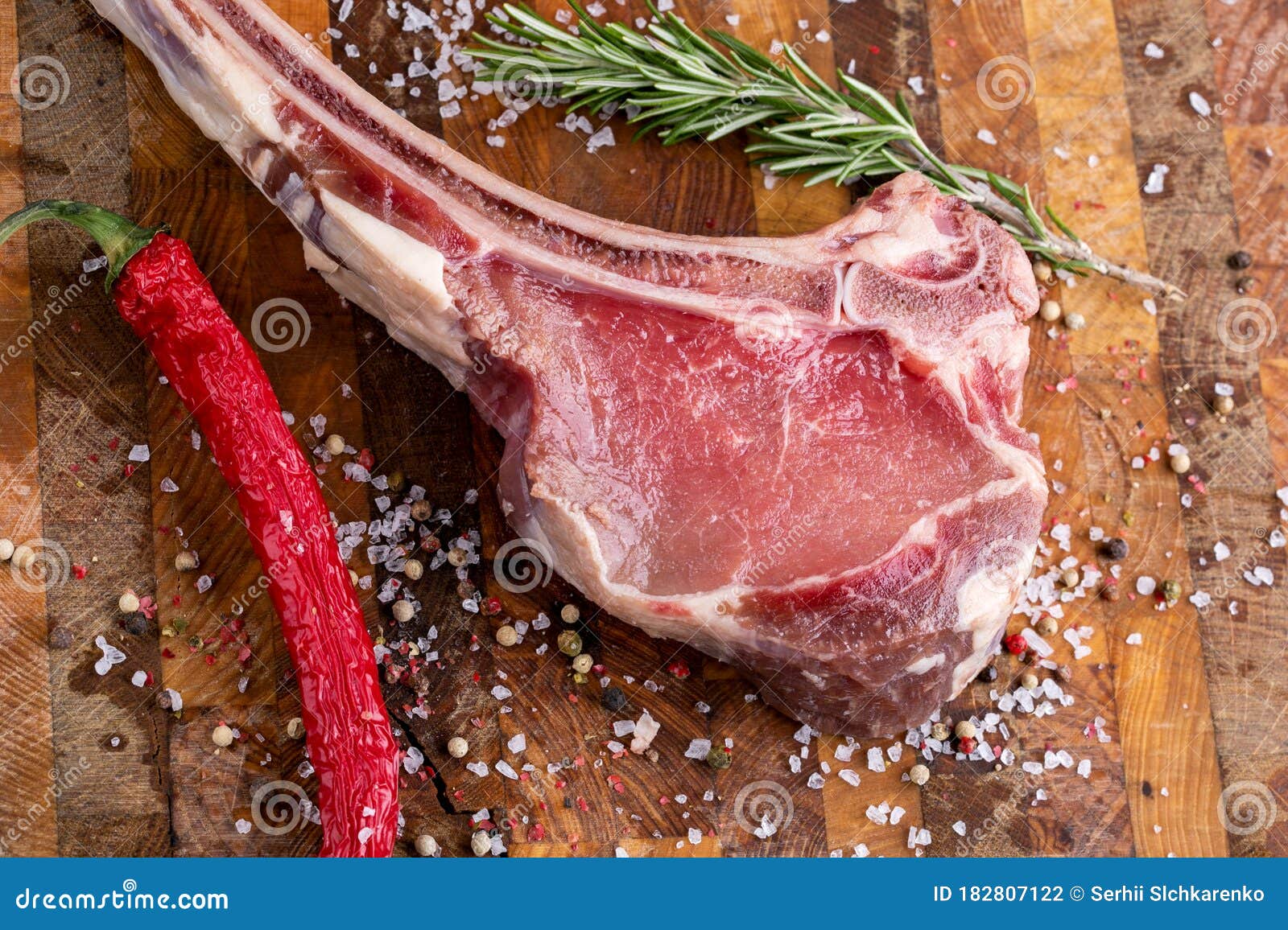 Raw Tomahawk Steak on Wooden Board Stock Photo - Image of bulb, beef ...