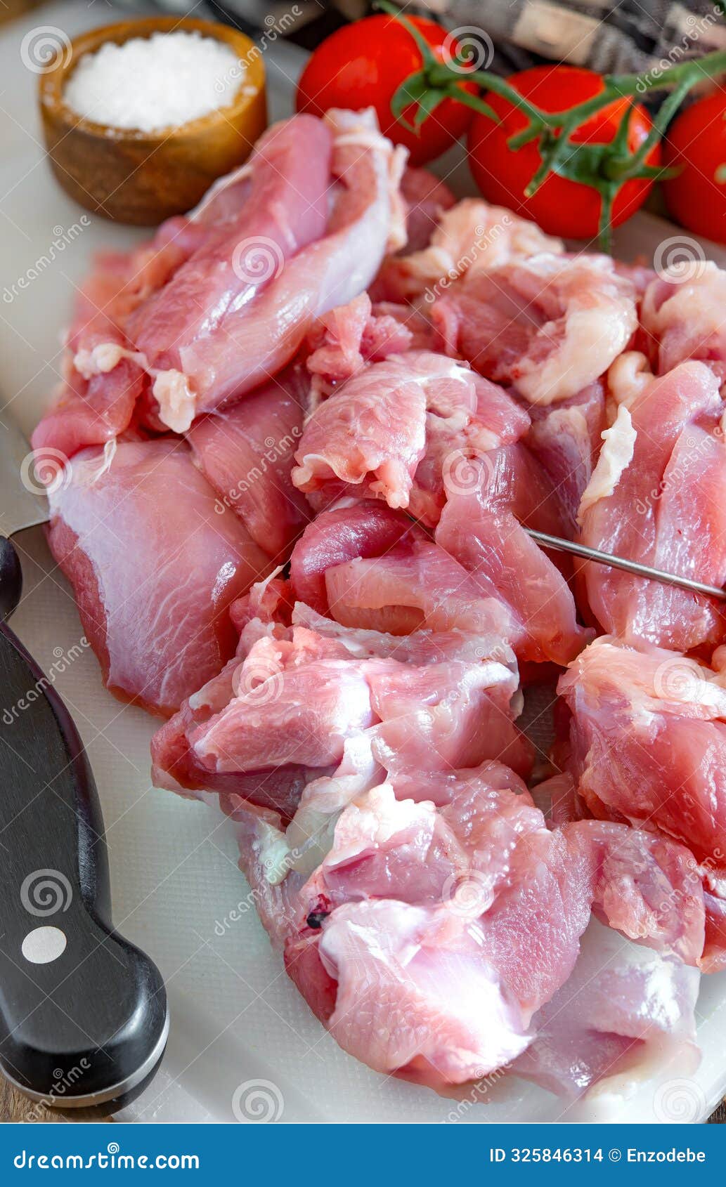 Chunks of Raw Turkey Meat on Cutting Board Stock Photo - Image of ...