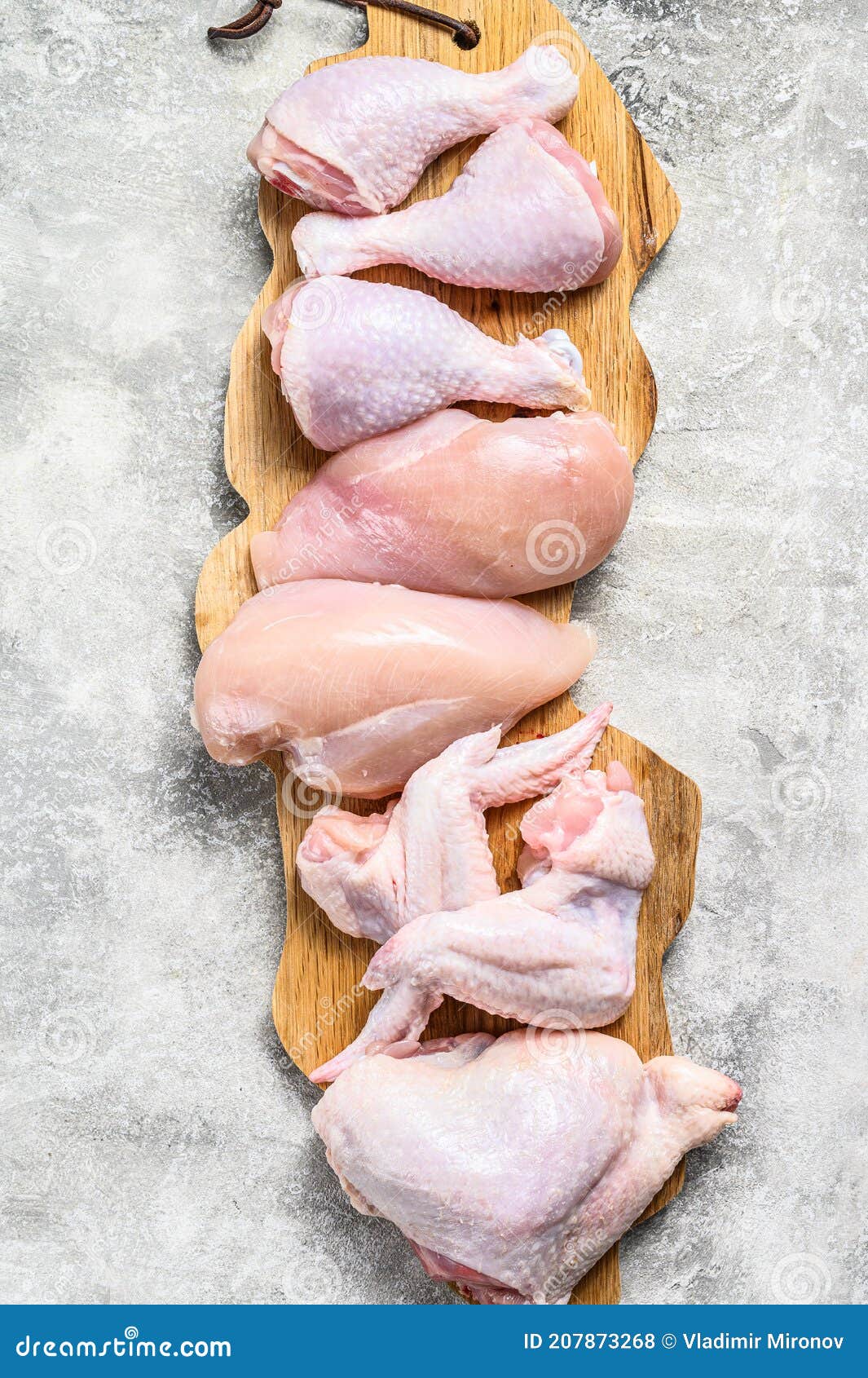 Raw Uncooked Chicken Meat on a Cutting Board. Gray Background Stock ...