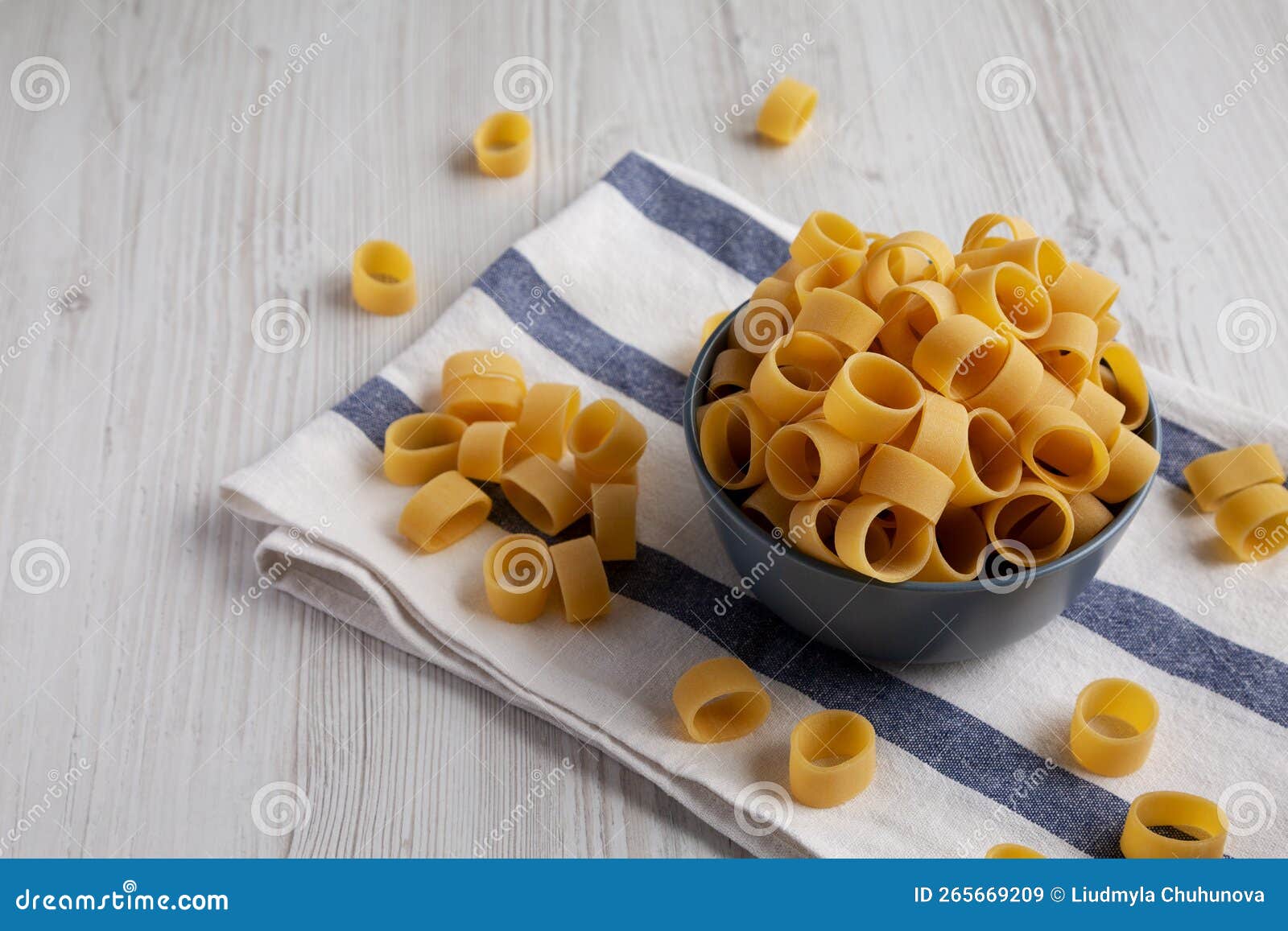 Raw Uncooked Pasta Calamarata in a Bowl, Side View. Space for Text ...