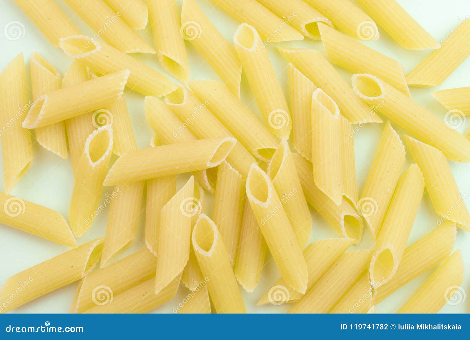 Raw Uncooked Pasta on Light Blue Background. Stock Photo - Image of ...